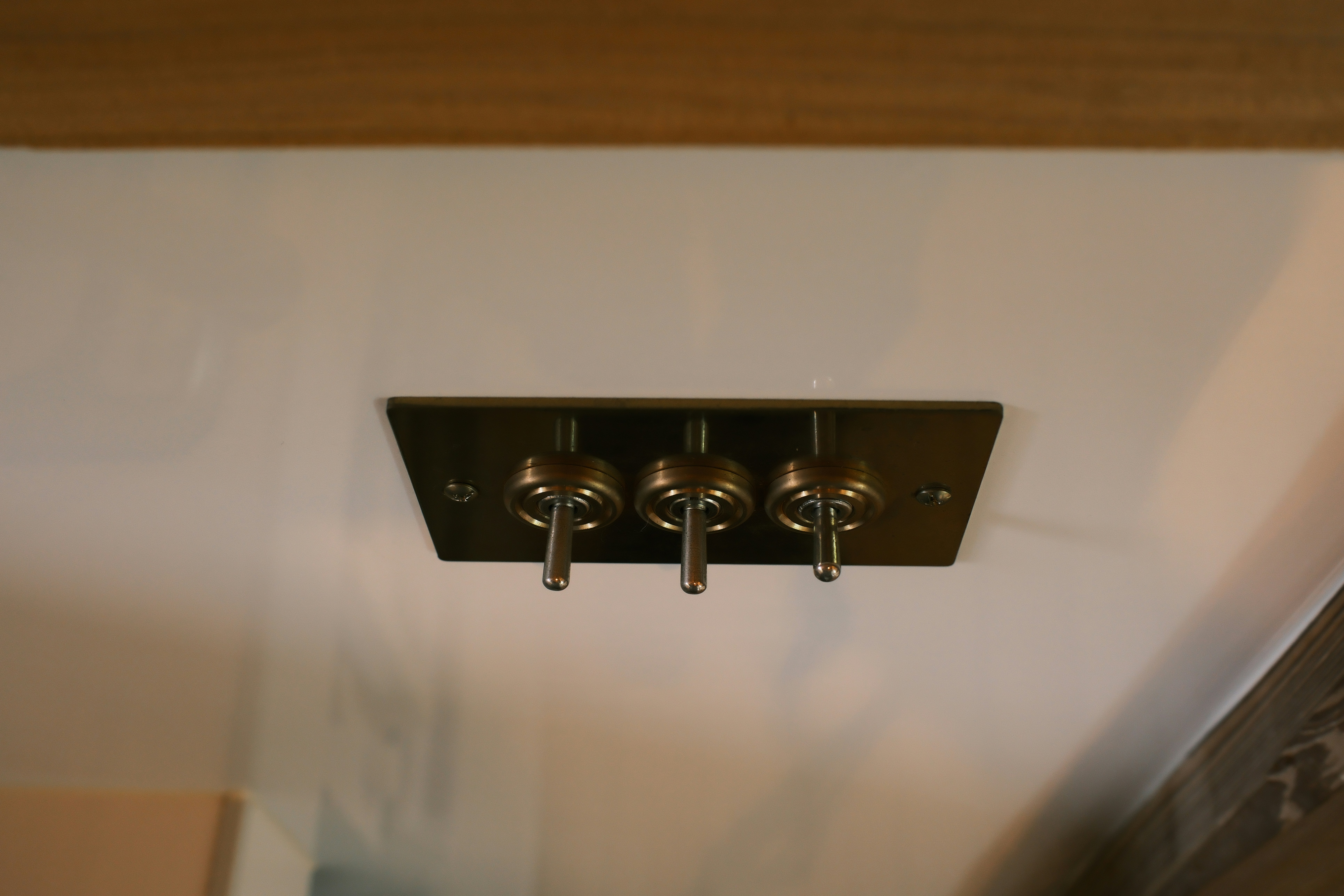 Three Knobs Dropping Light into a Quiet Room
