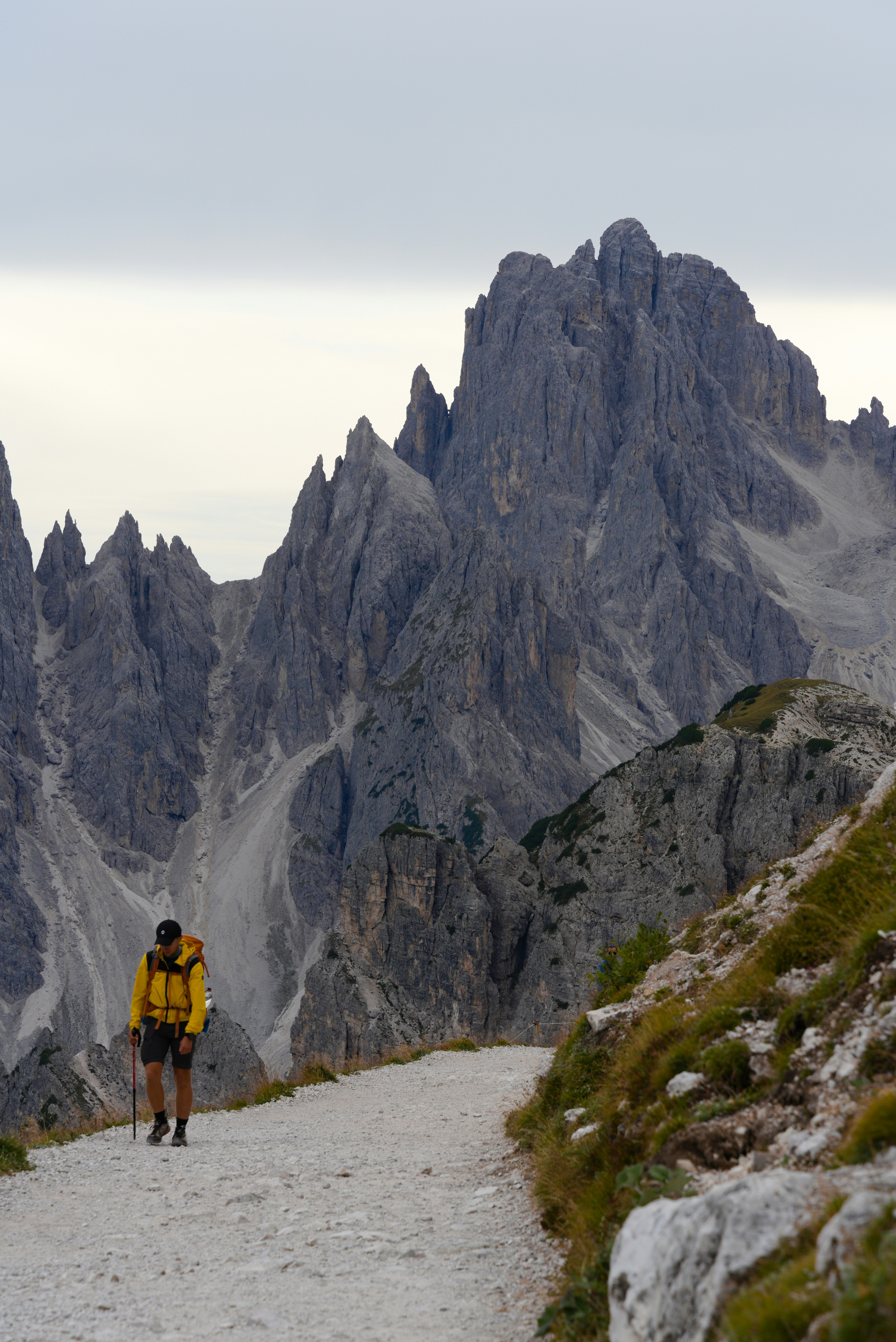Trail to the Giants: A lone hiker and jagged peaks