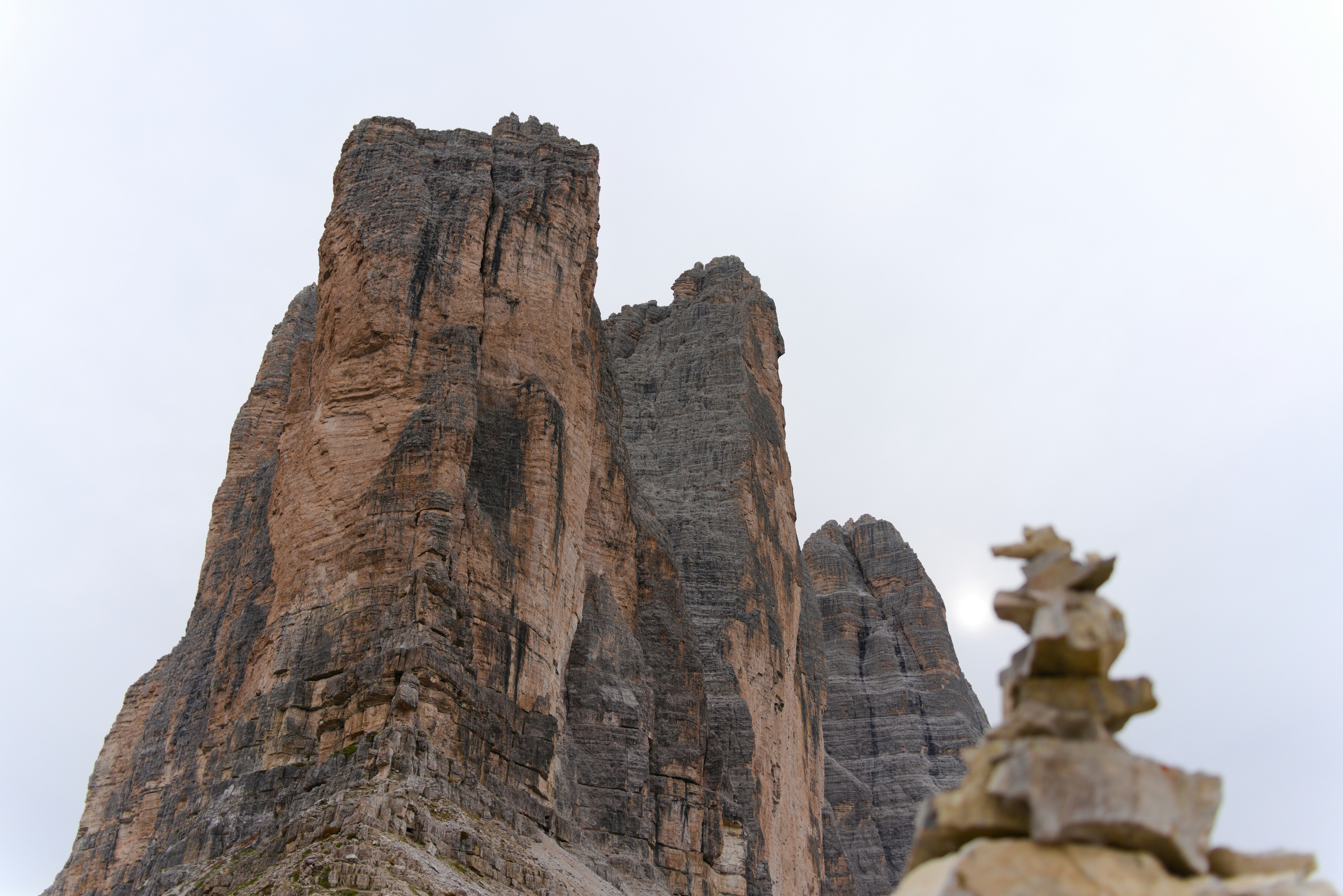 Stone Monoliths: A Towering Duo Framed by a Quiet Summit