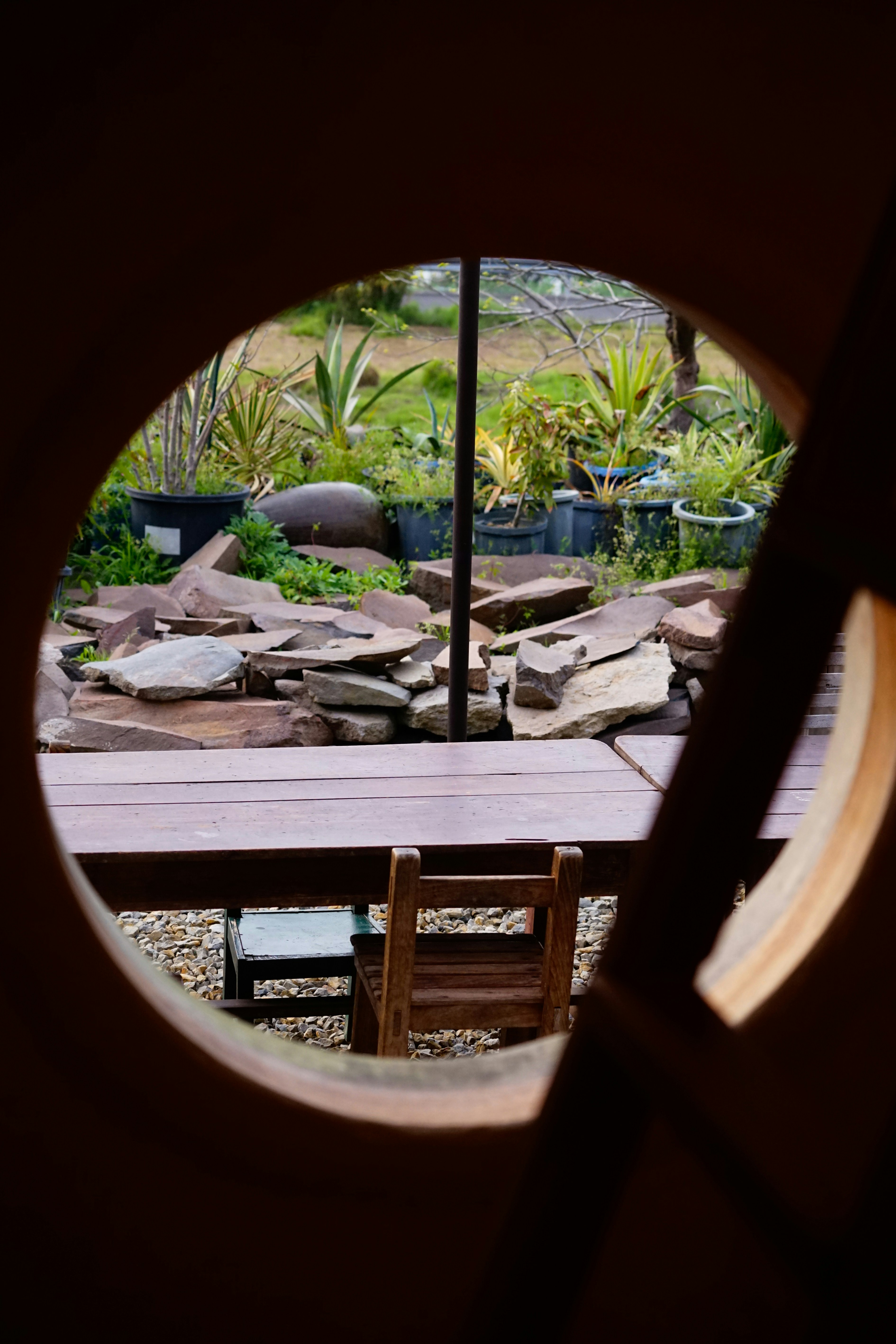 Circular window to a tranquil garden mosaic