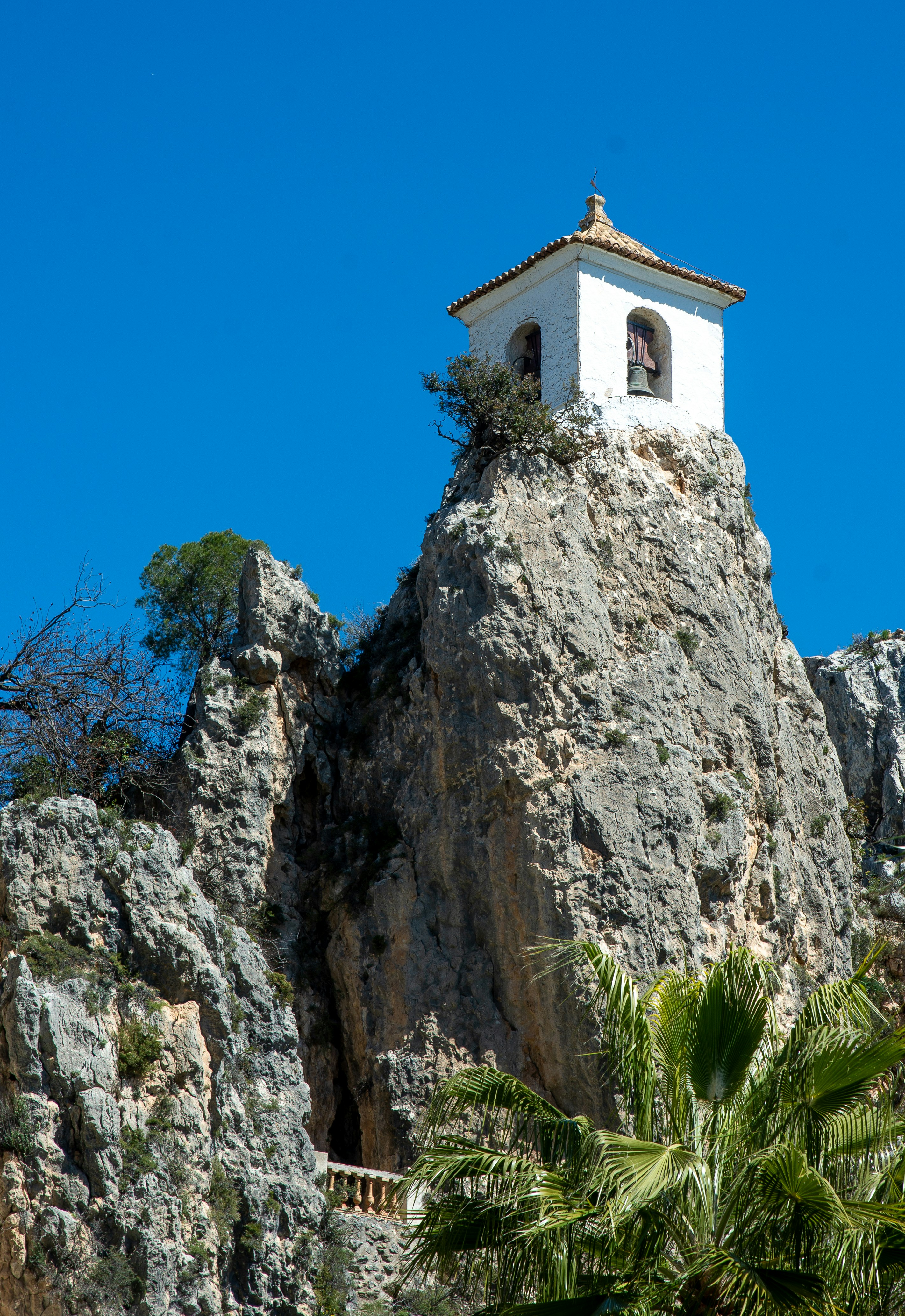 A chapel Crowned on a Cliff: Quiet Vigil Above the Olive Barranco