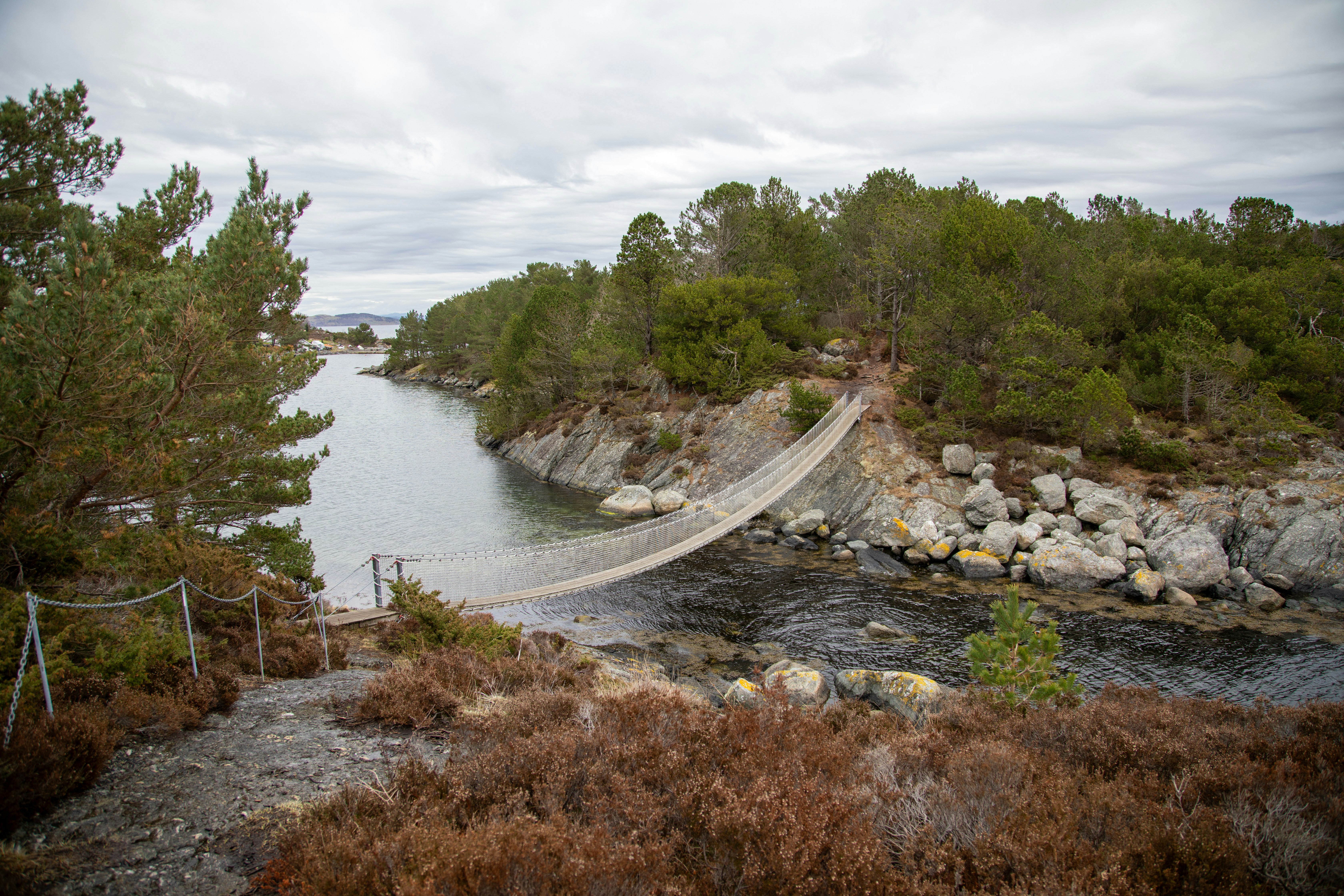 Suspended Bridge Over Quiet Nordic Waters