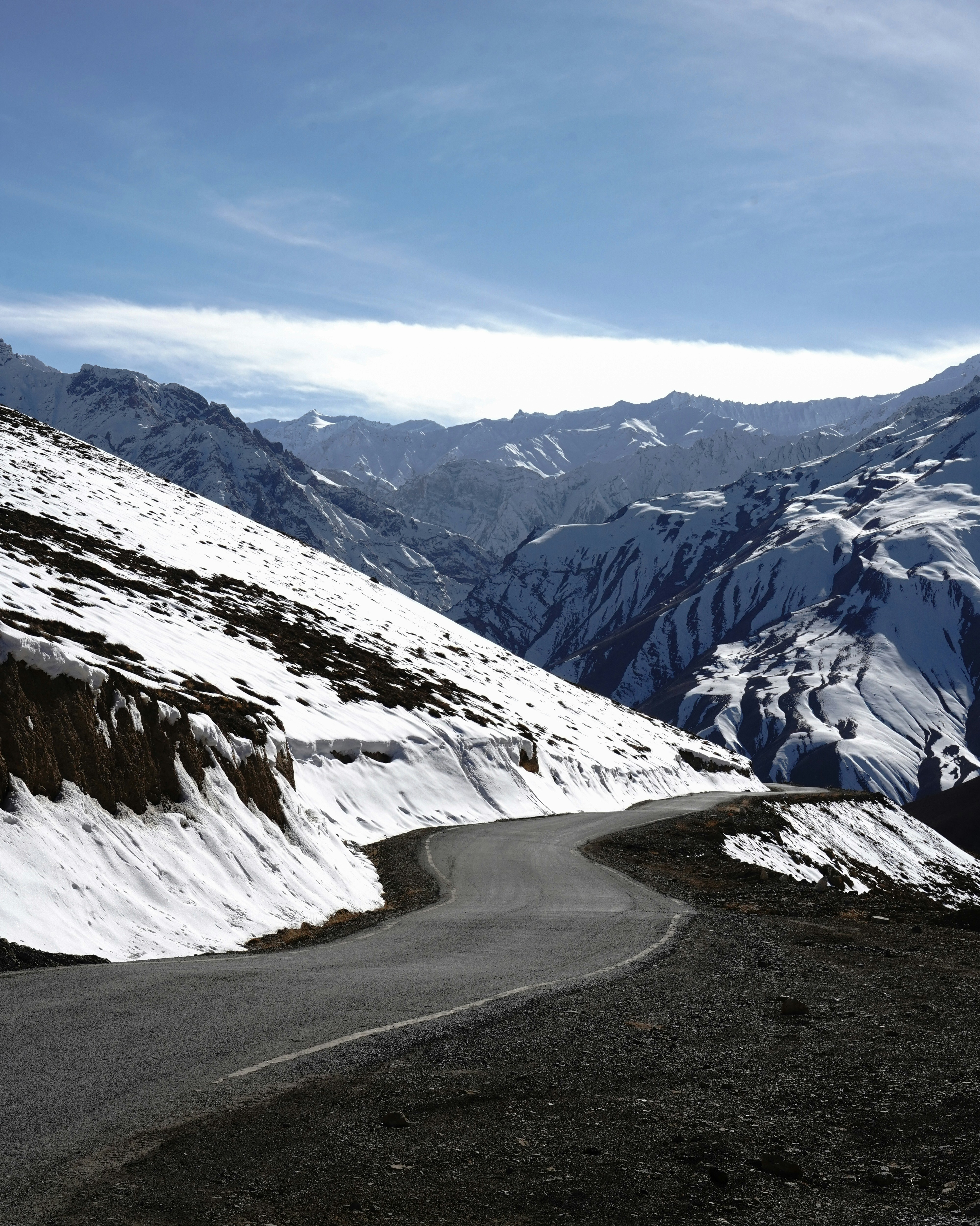 Snowbound Switchbacks Beneath A Clear Alpine Sky