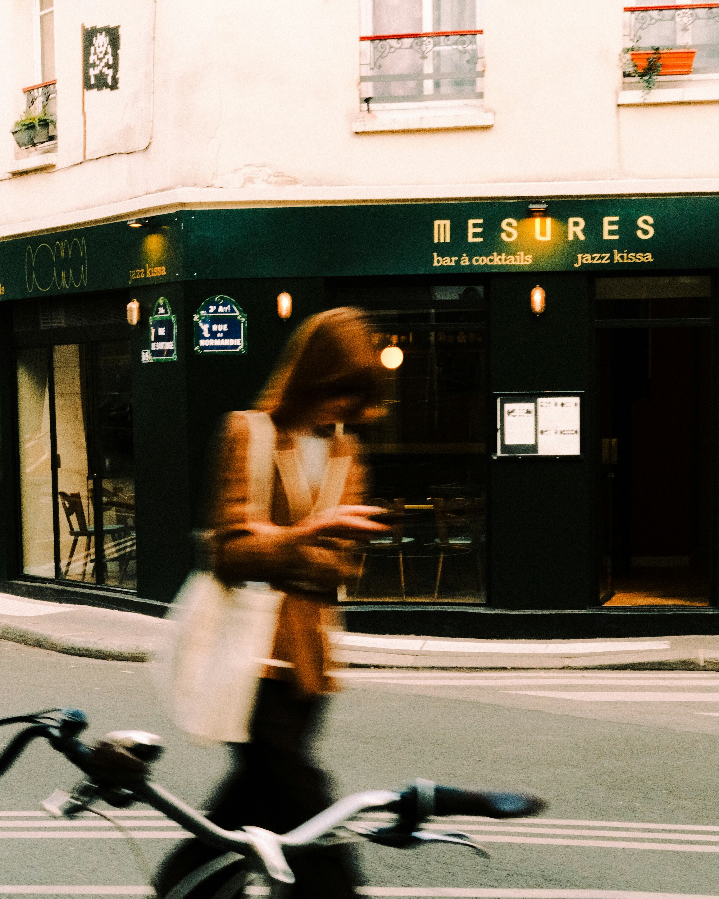 Blurred Pedestrian in Front of a Jazz Bar
