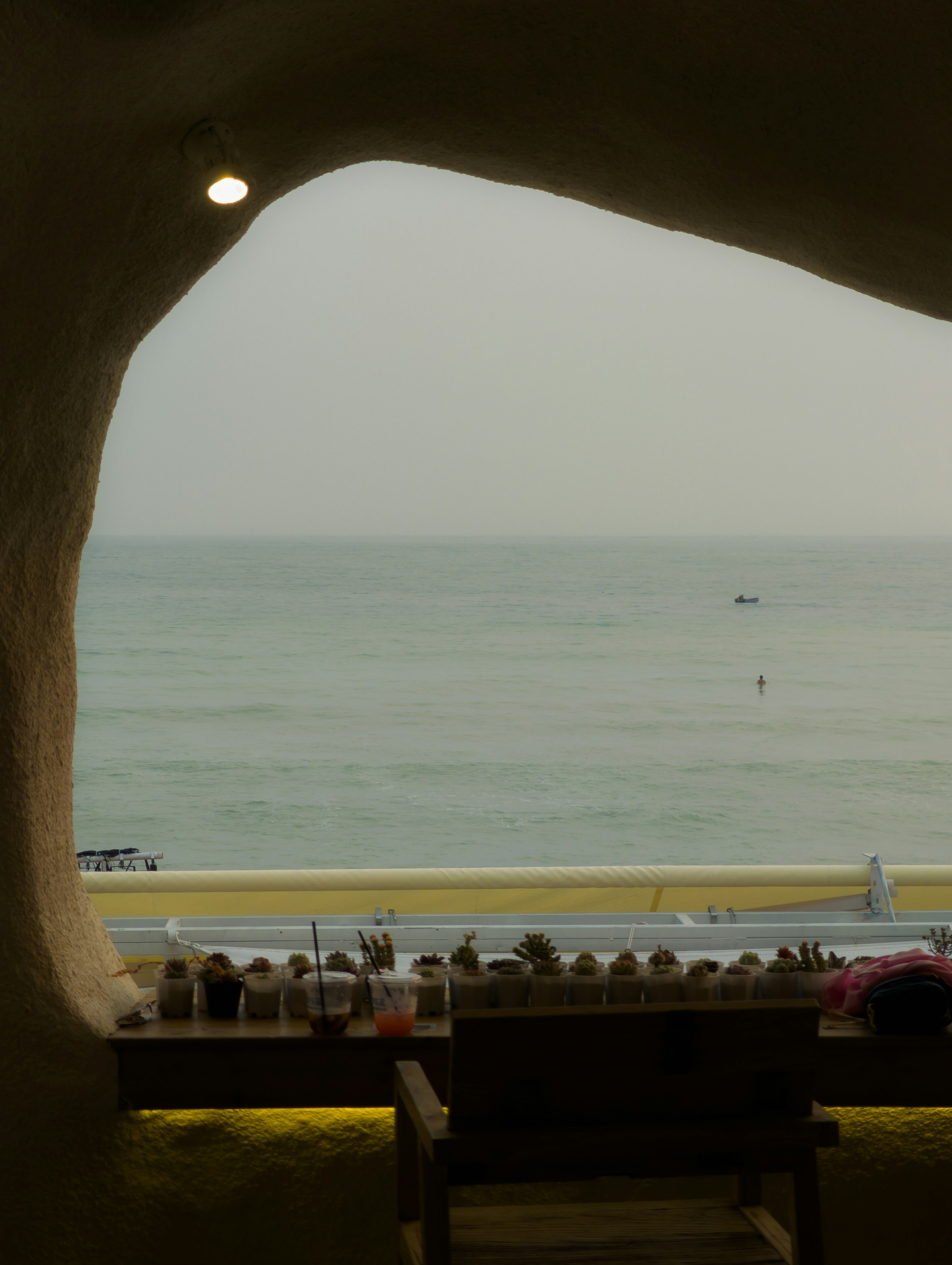 View Through a Sea-Side Arch: Quiet Ocean from a Caved Deck