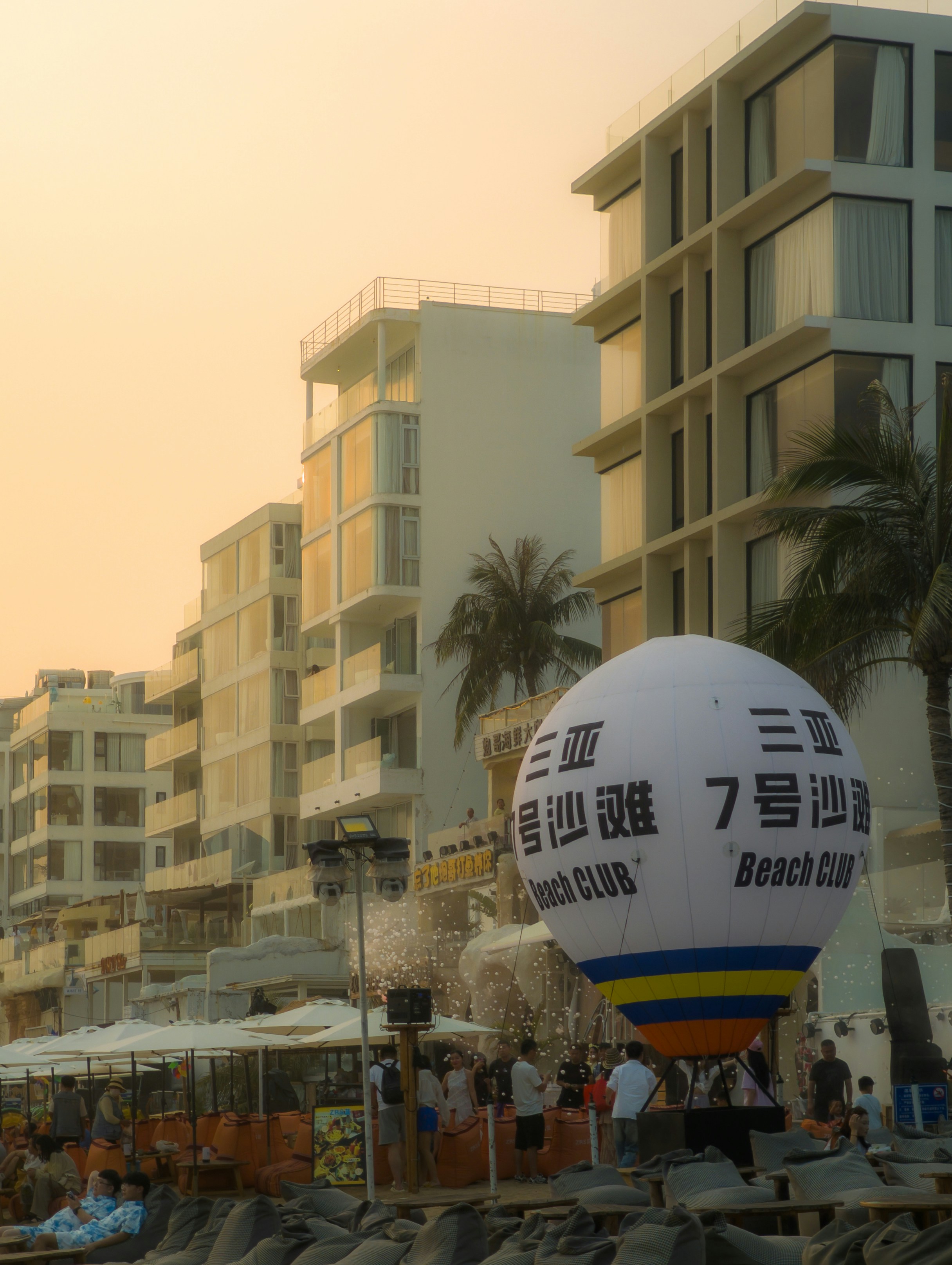 Sunlit Beachfront Hotels and Ballooned Welcome Sign