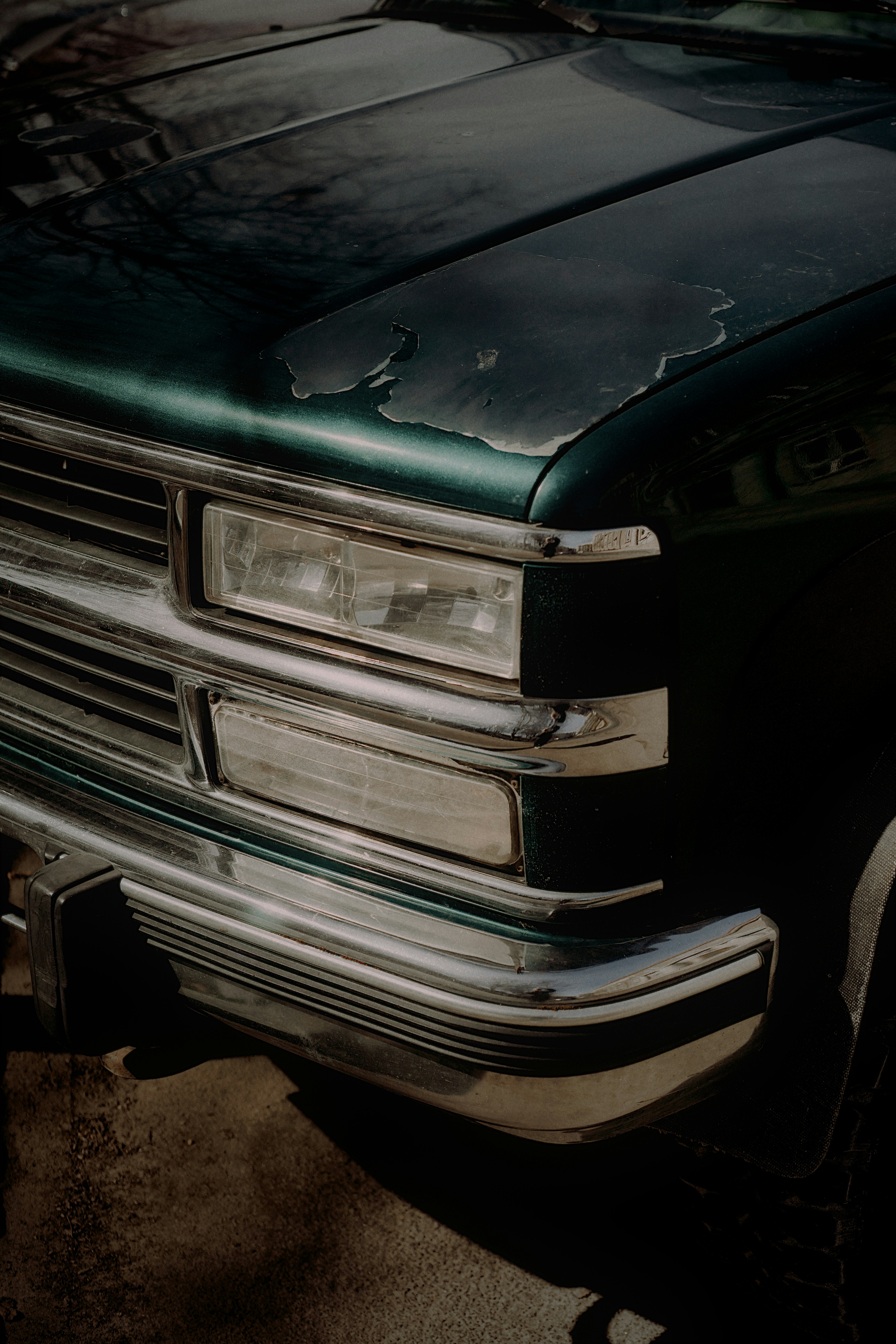 Peeling Green Hood on a Weathered Truck