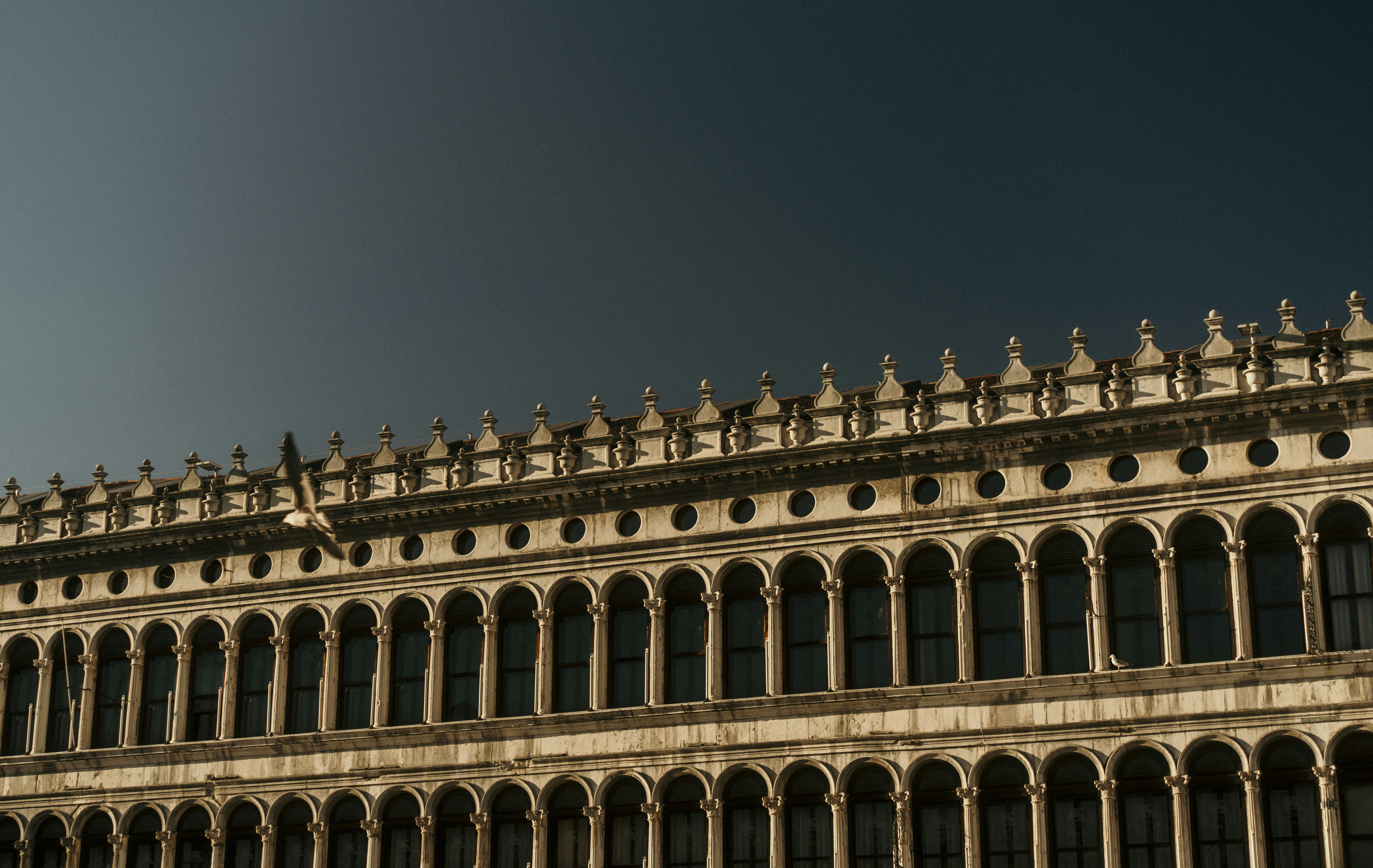 Arched Veil: Repetition and Light on a Classical Facade