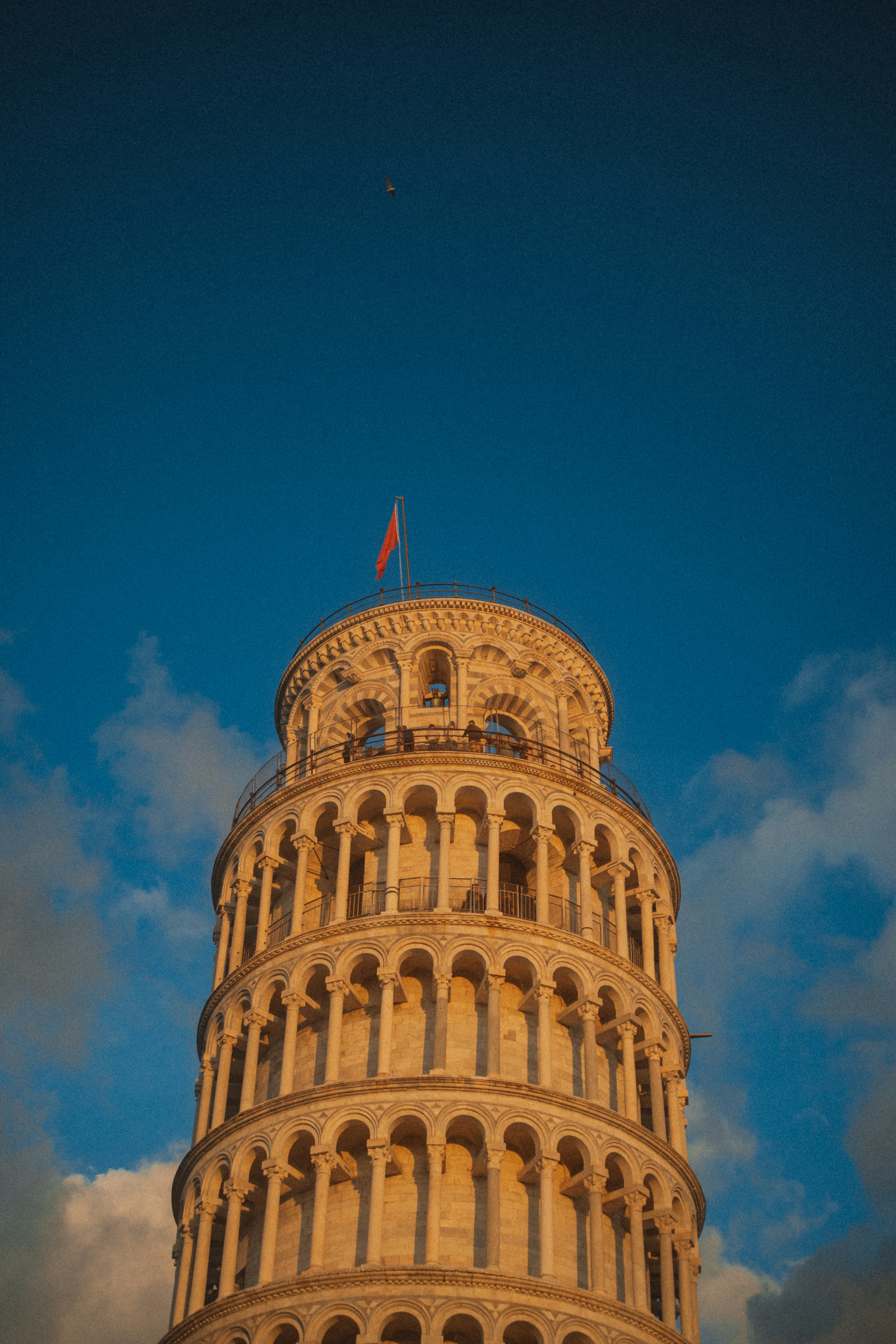 Sunlit Bell Tower Rising Against a Clear Blue Sky
