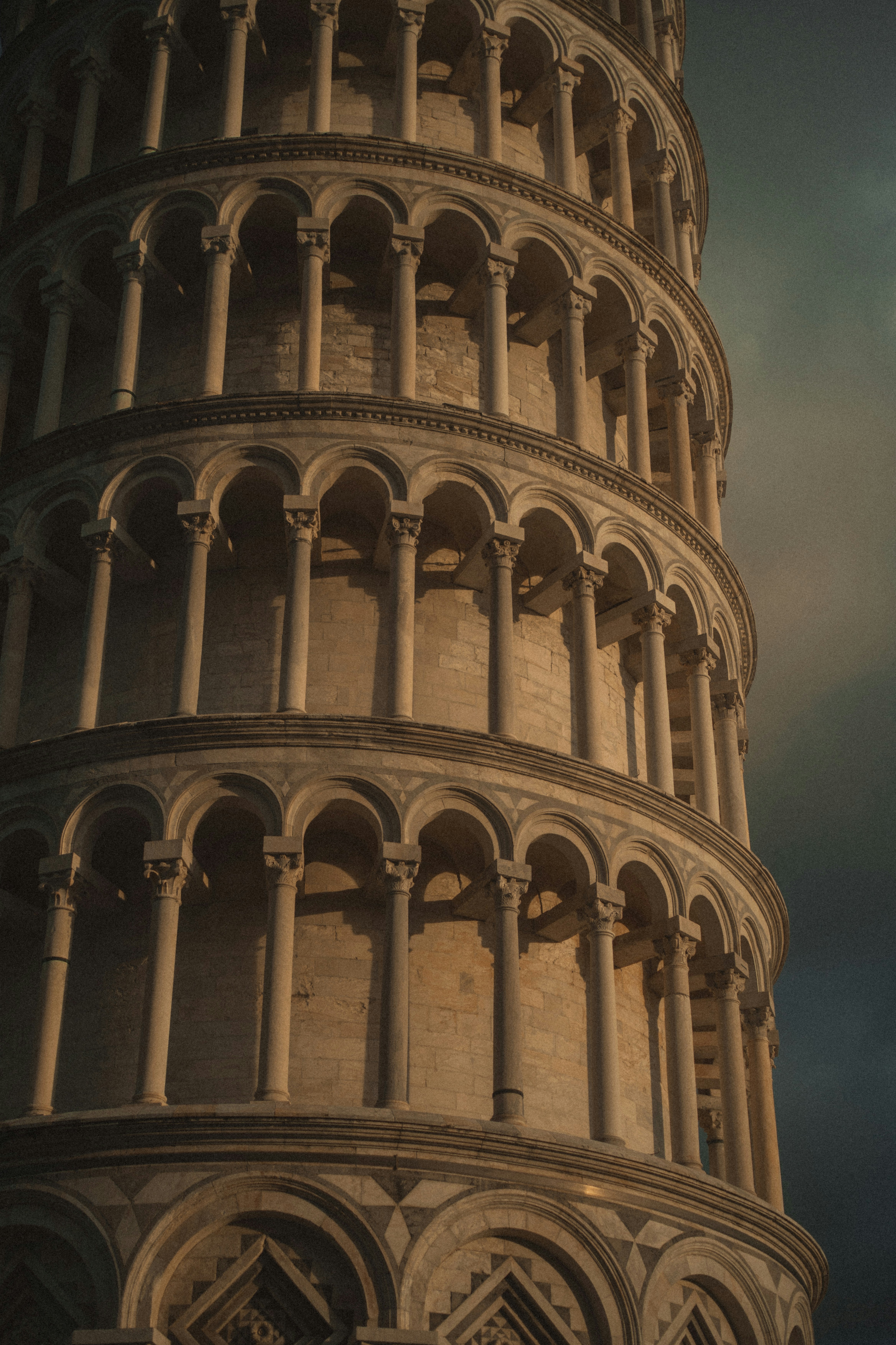Timeworn Harmony: The Leaning Bell-Tower’s Carved Arches