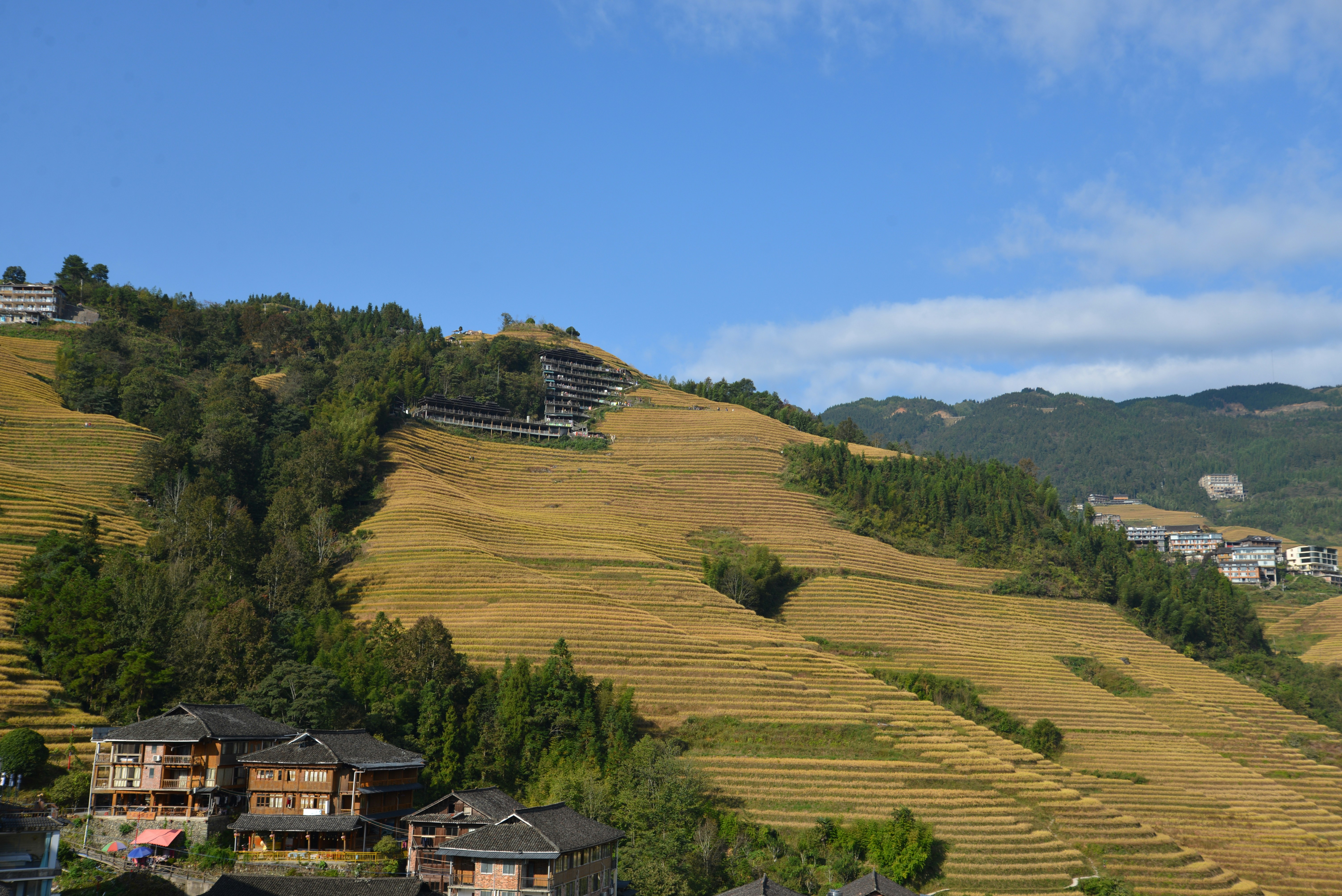 Terraced hillside village under a clear blue sky
