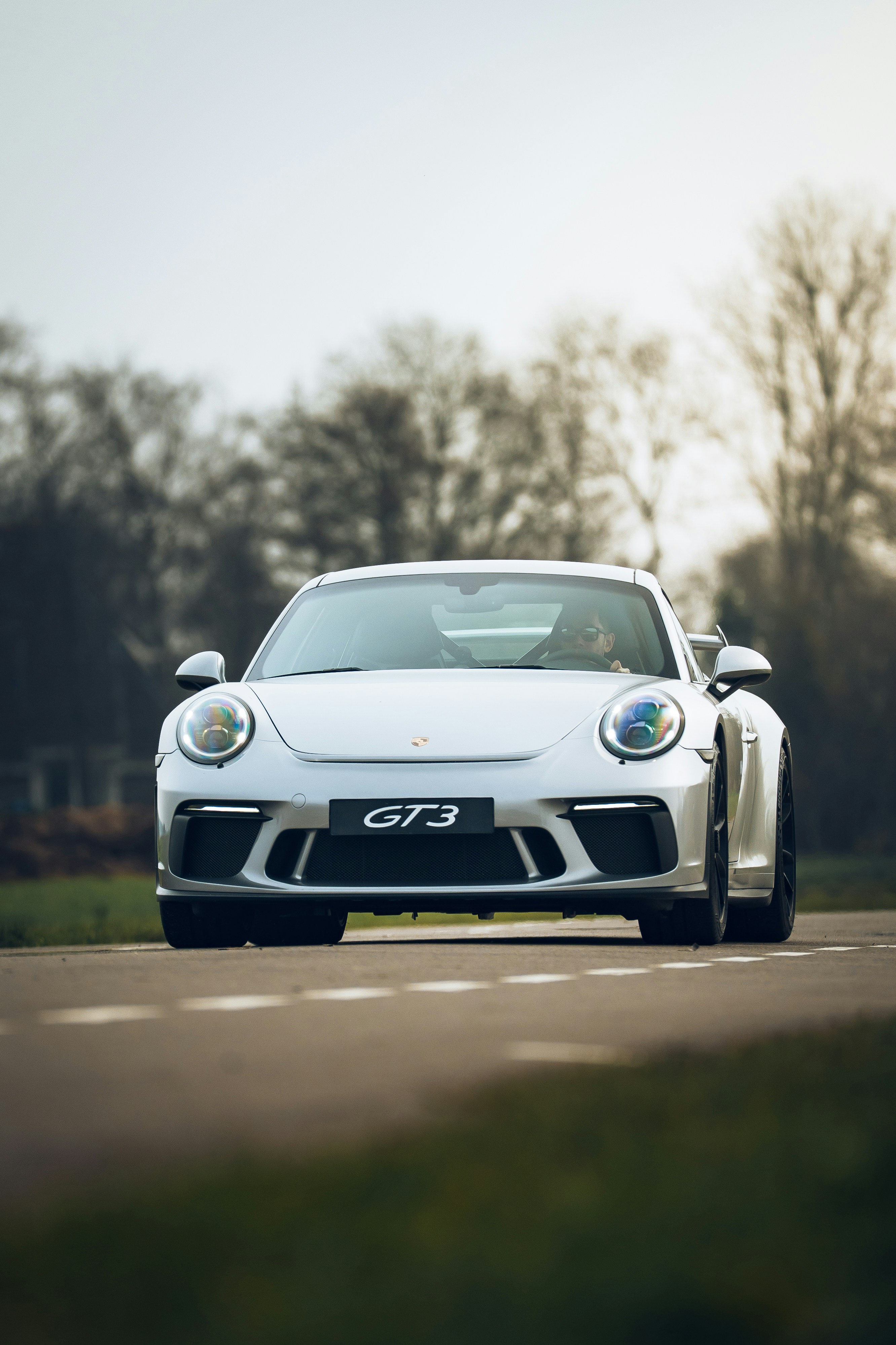 Porsche GT3 in Focus: Low-Angle Drive Past the Wireline