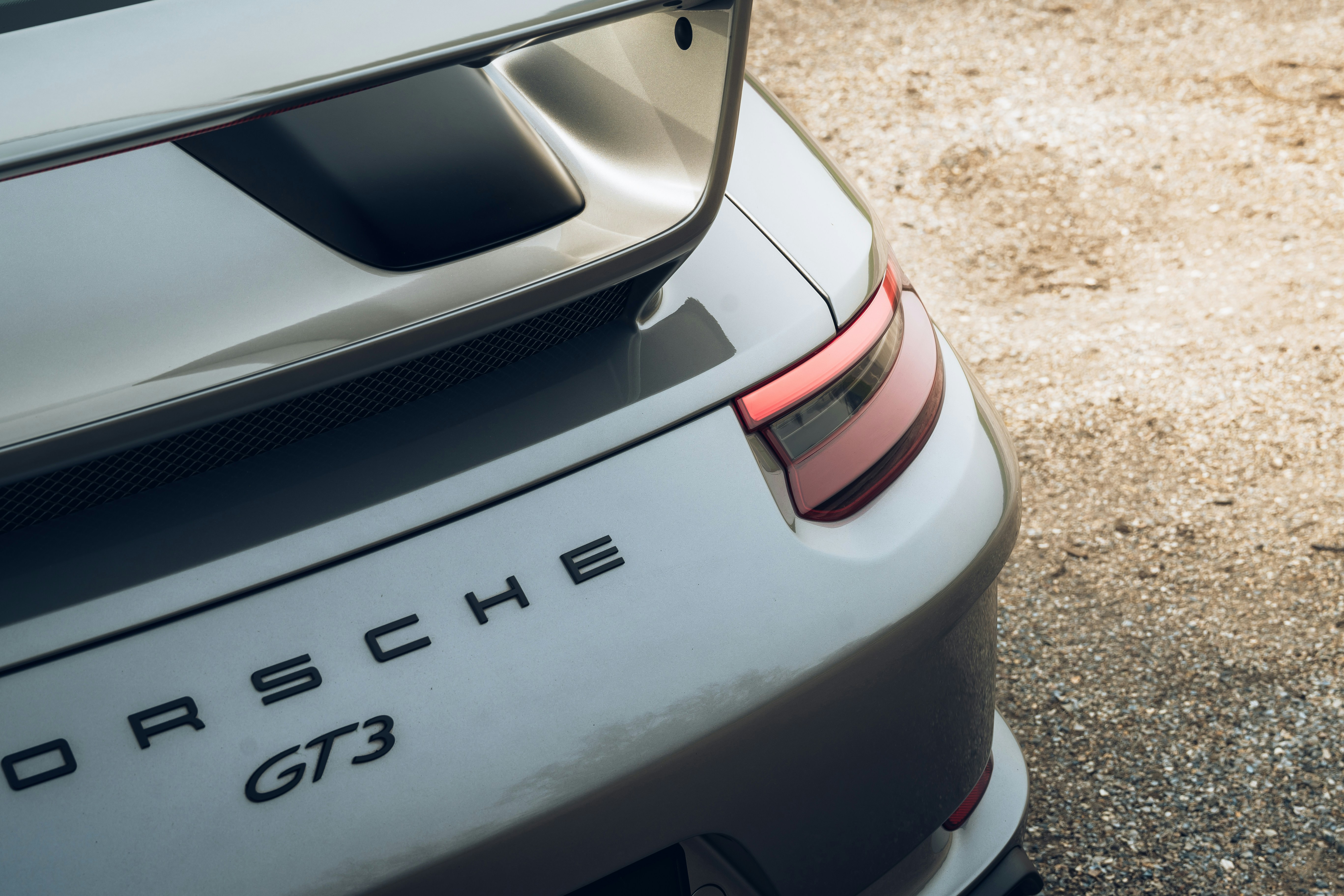 Porsche GT3 Seamlessly Framed: Curves and Script in Steel Gray