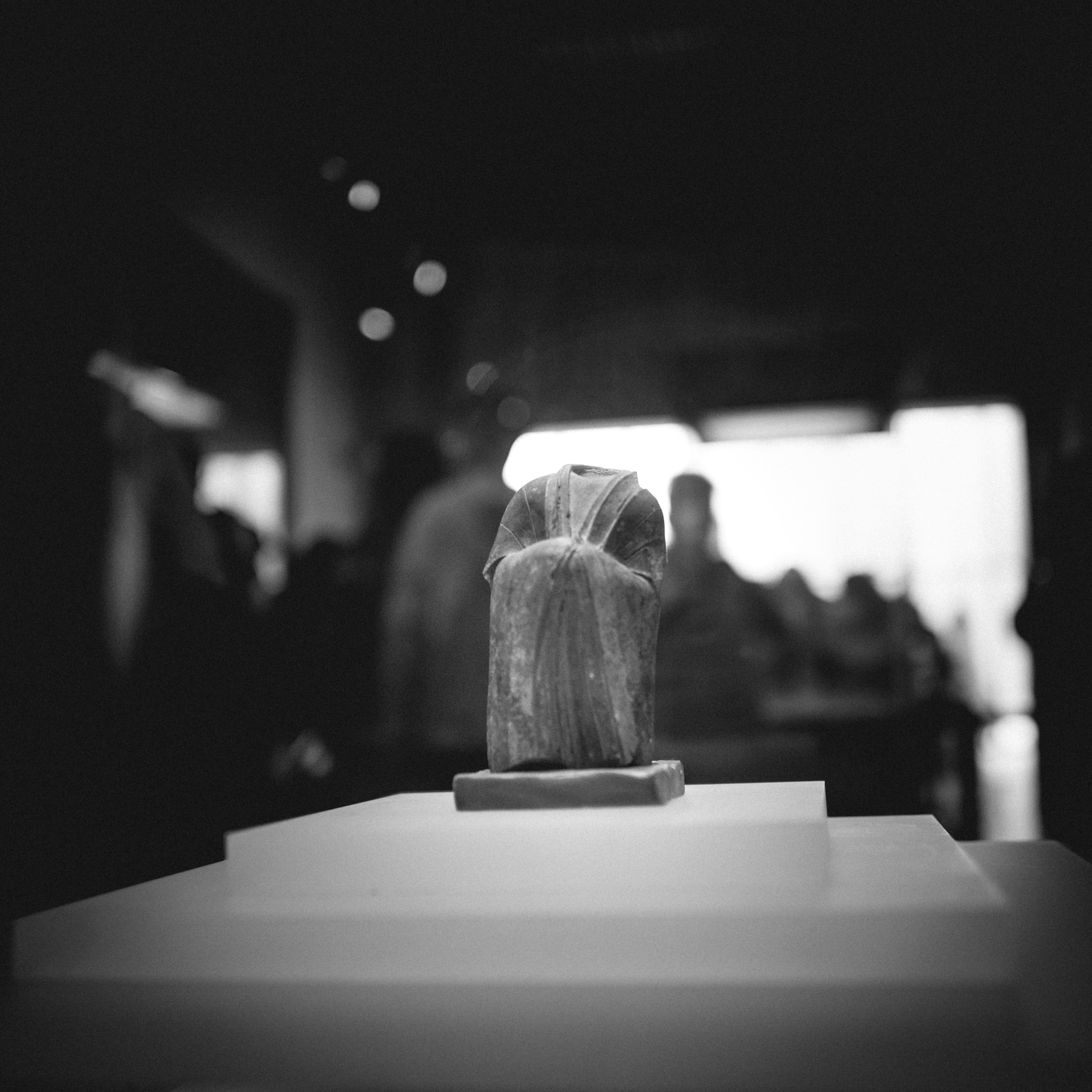 Stone Figure on a Pedestal: Soft Light, Sharp Focus
