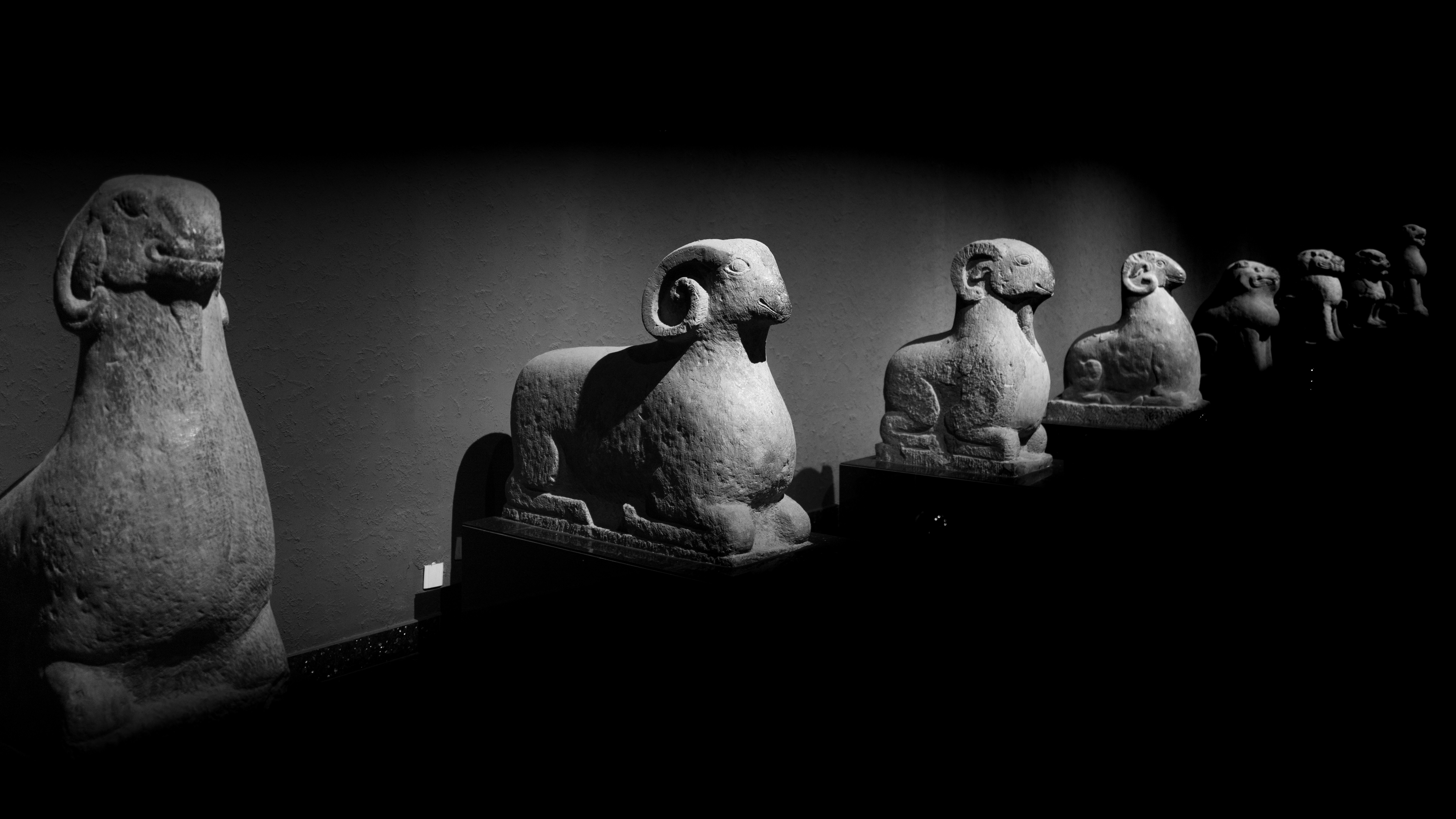 Row of Ancient Guardians in Monochrome Light