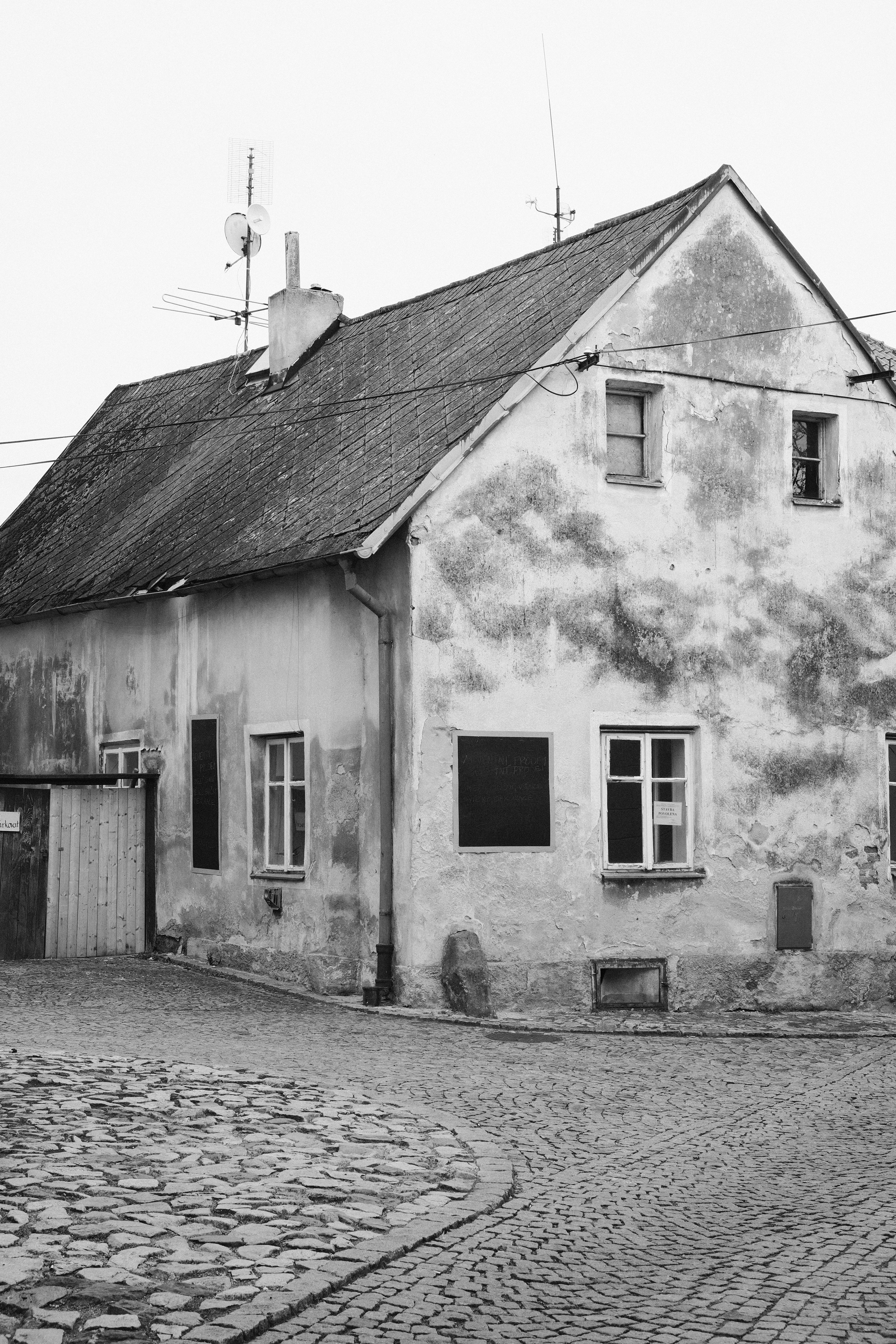 Weathered Facade on a Quiet Cobbled Lane