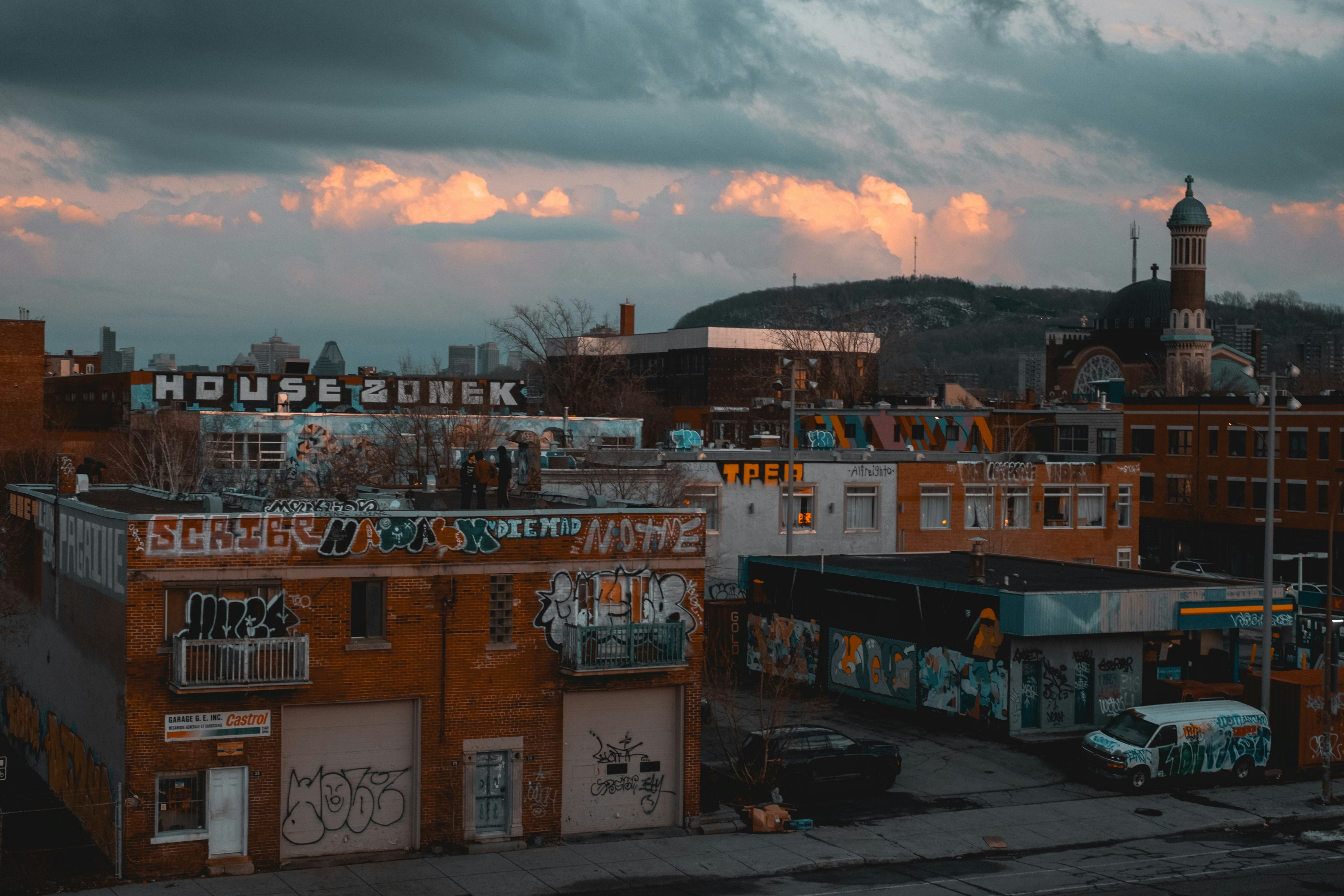 Rooftop City Graffiti and Sunset Skyline