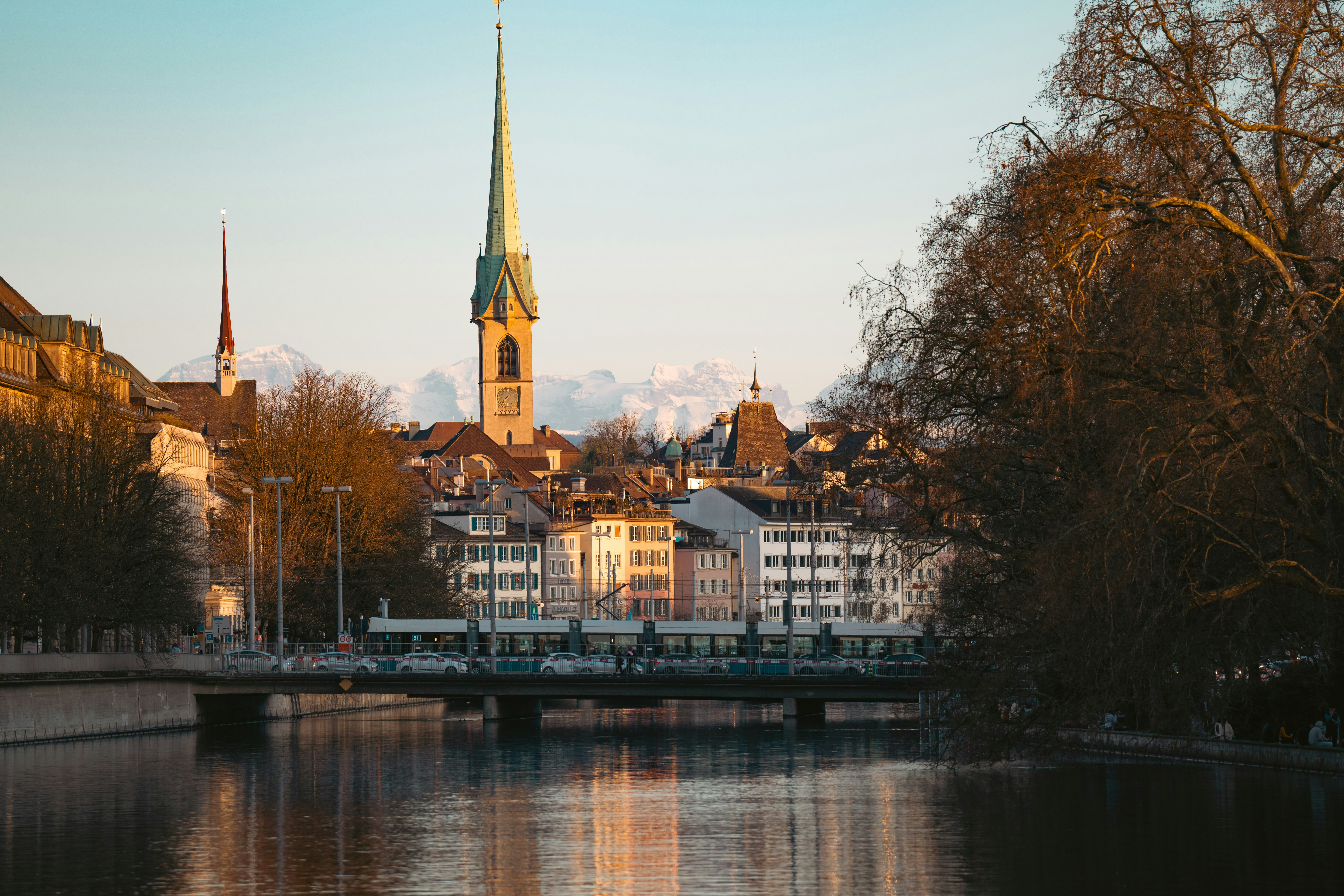 City by the River: Echoes of a Spired Town at Sunset