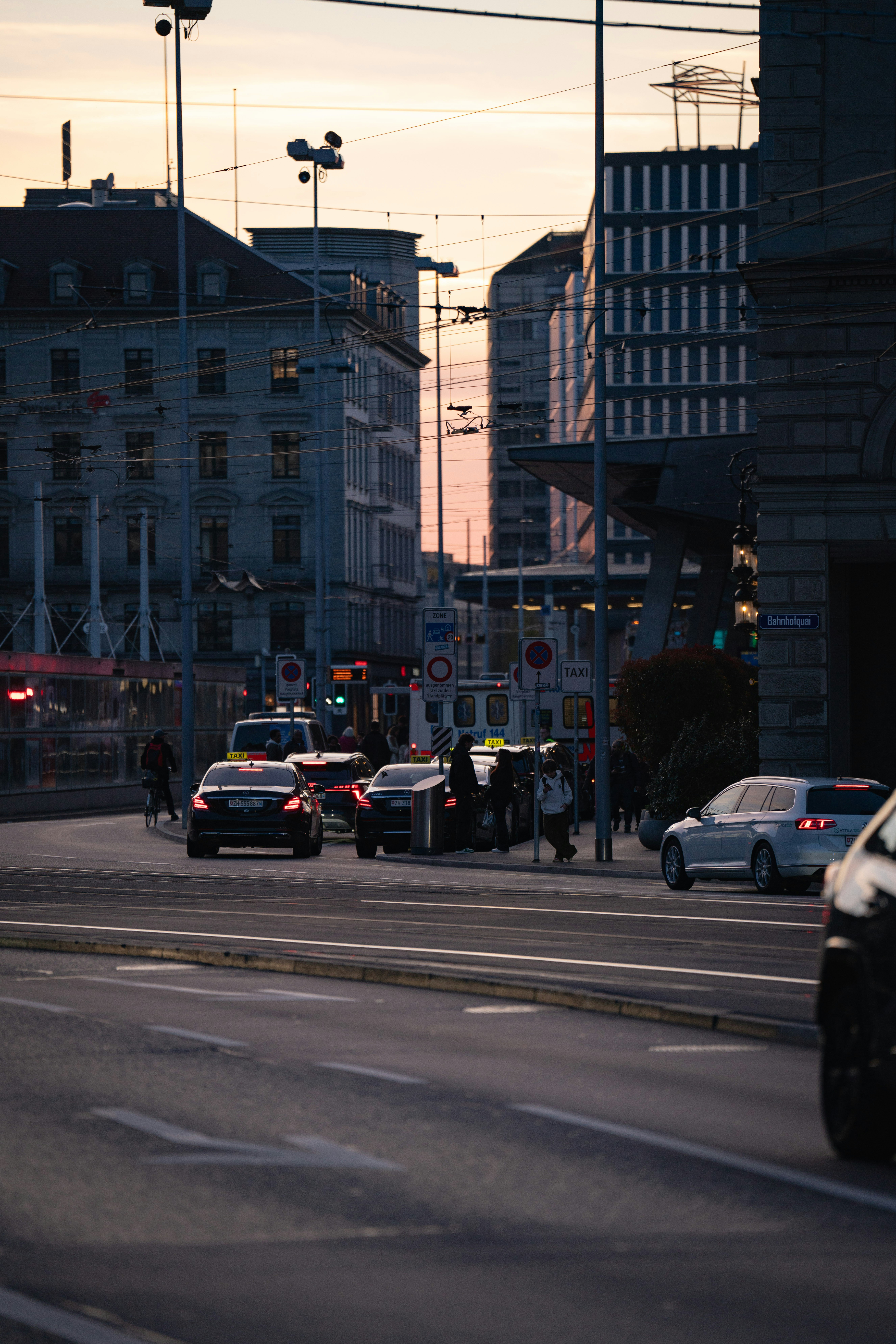 City at Dusk: Cars, Crossroads, and the Quiet Edge of Sunset