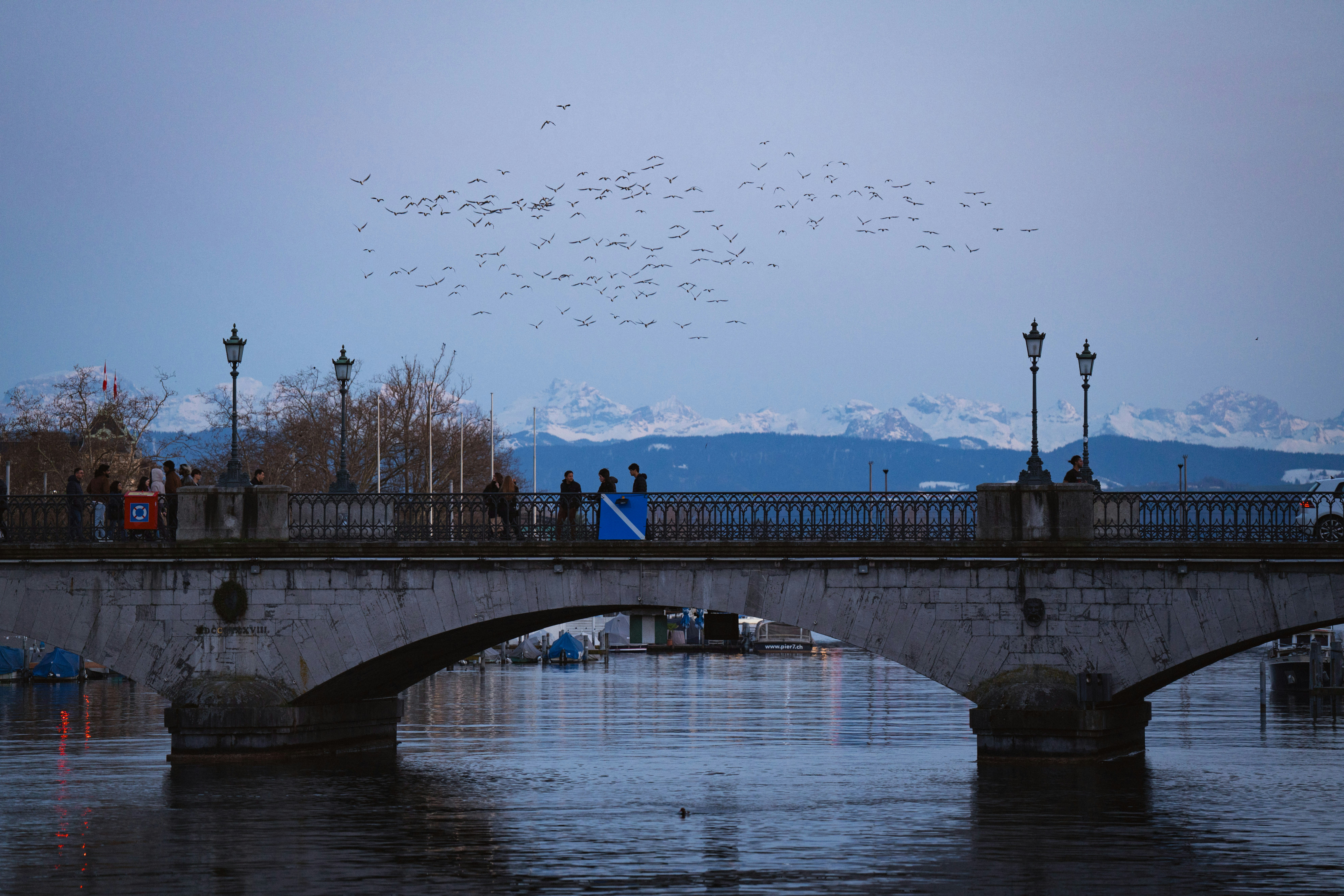 Dawn over the Arched Bridge: A Quiet Waterfront Chorus
