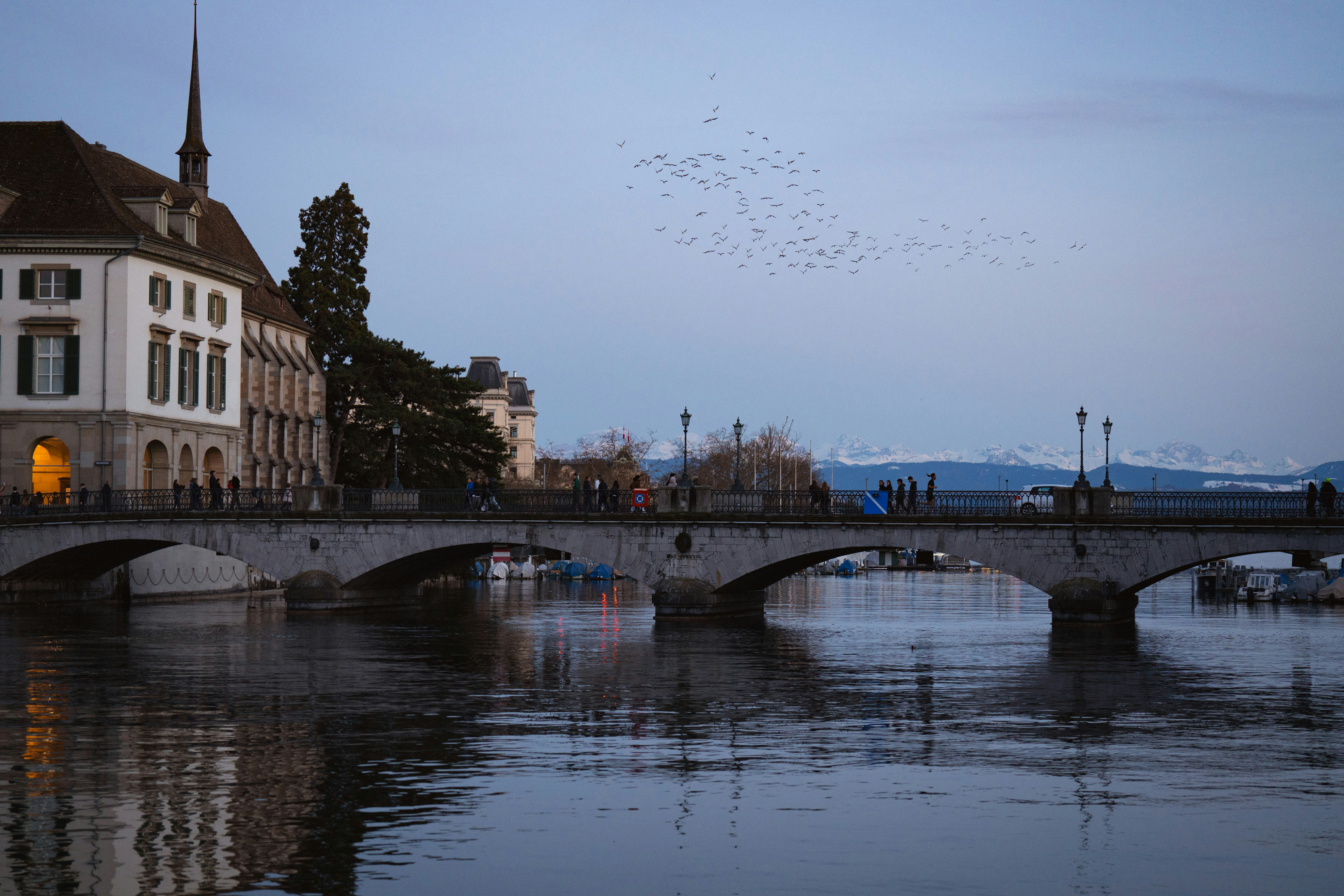 Dusk Over the Arched Bridge: Echoes of a Town by the Lake