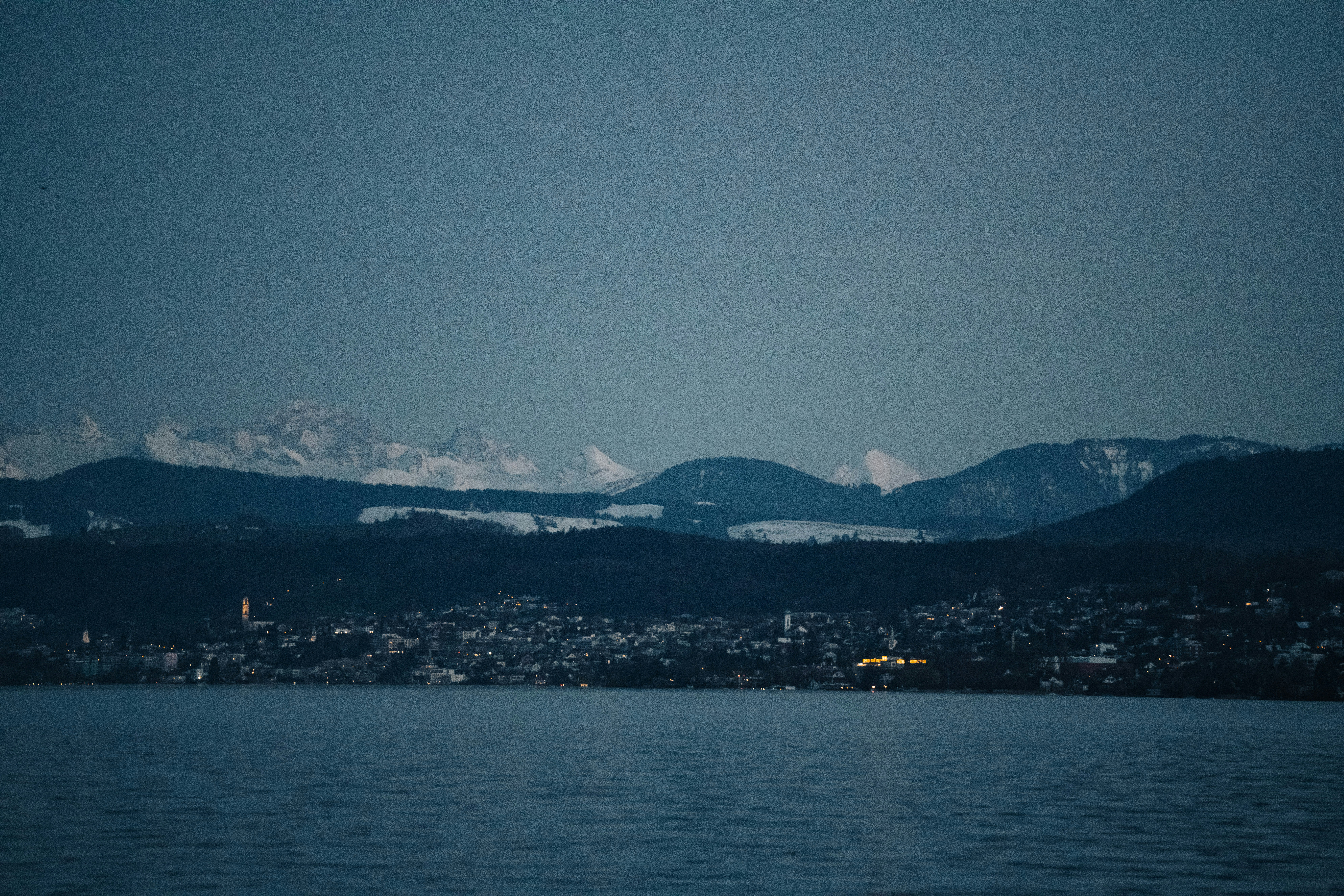 Coastal Town Silhouette Under Quiet Evening Sky