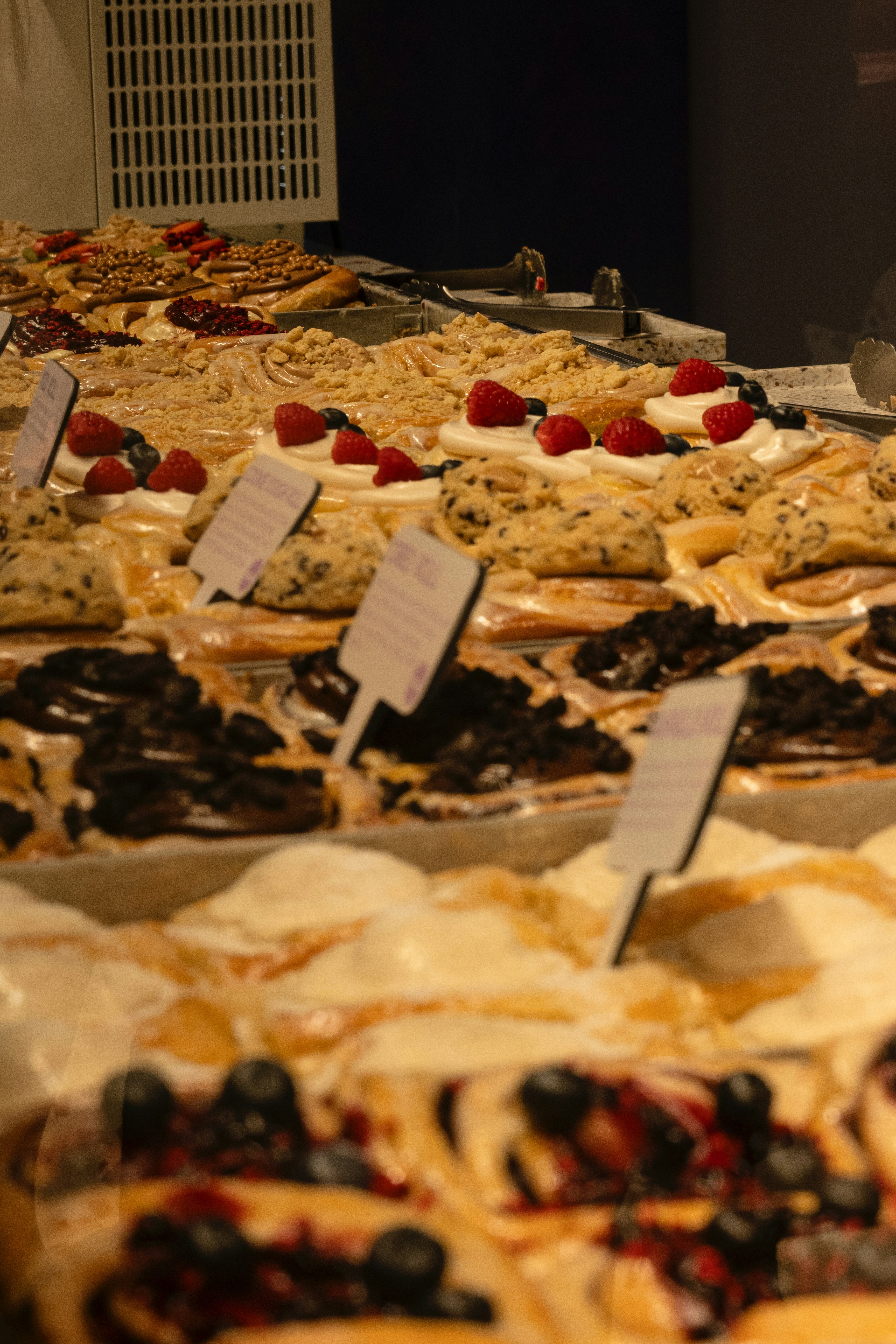 Pastry Display: A Rich Assortment of Tarts and Berries