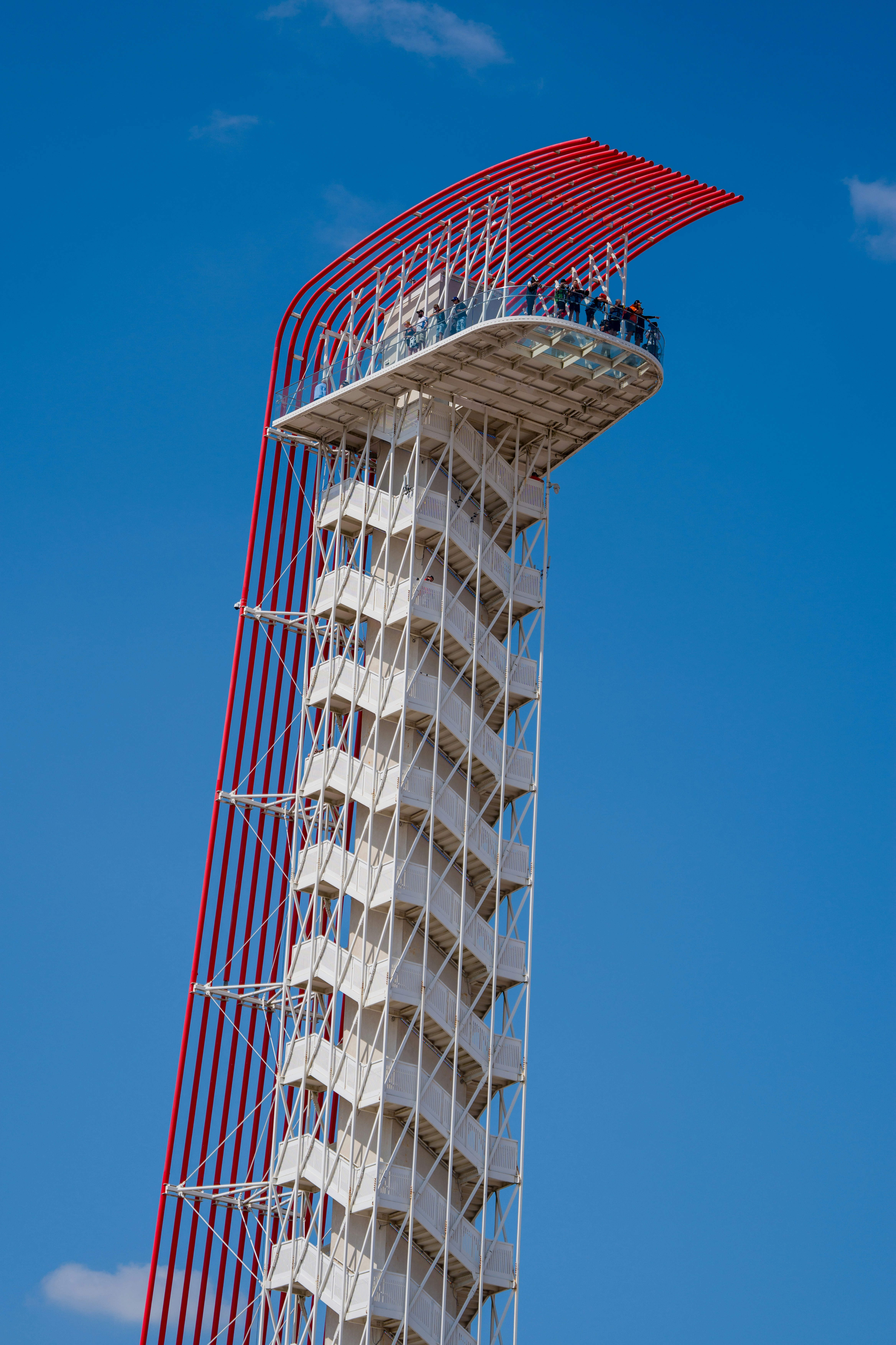  Red Tower Above the Blue: Aerial View from a Skyward Platform