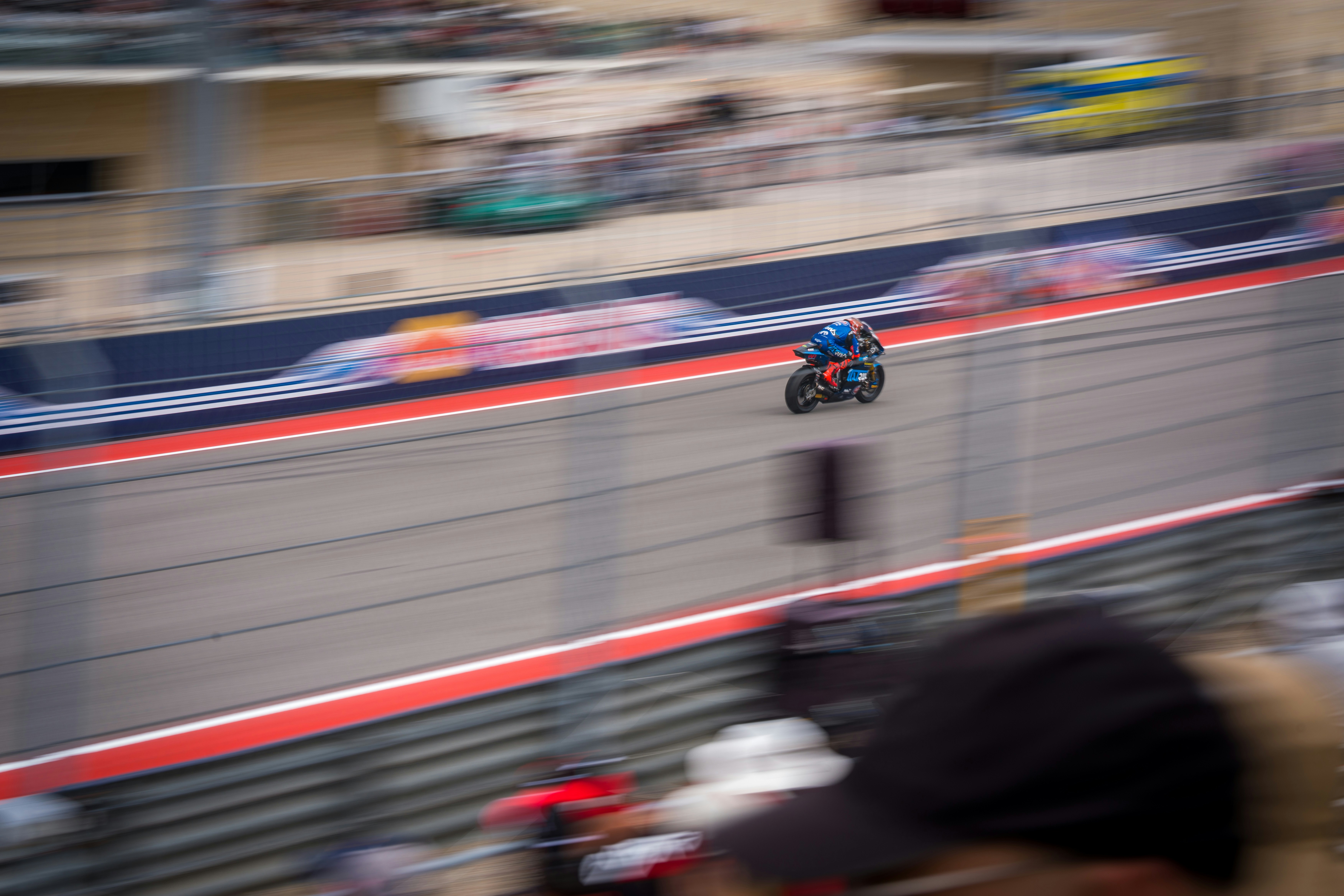 Blurred Velocity: A Lone Rider Clings to the Curve