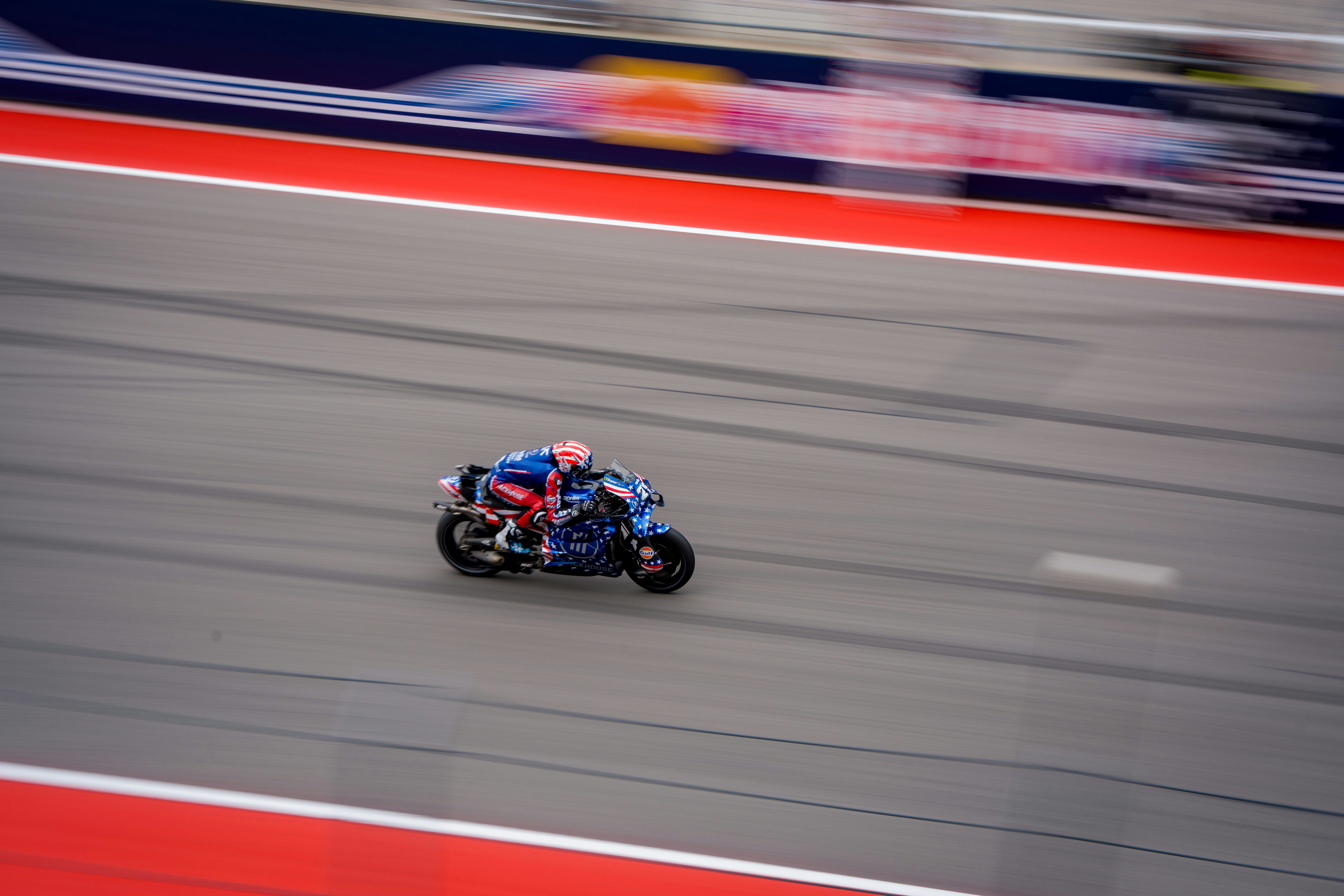 Blitz on Asphalt: Focused Sprint of a Moto Racer