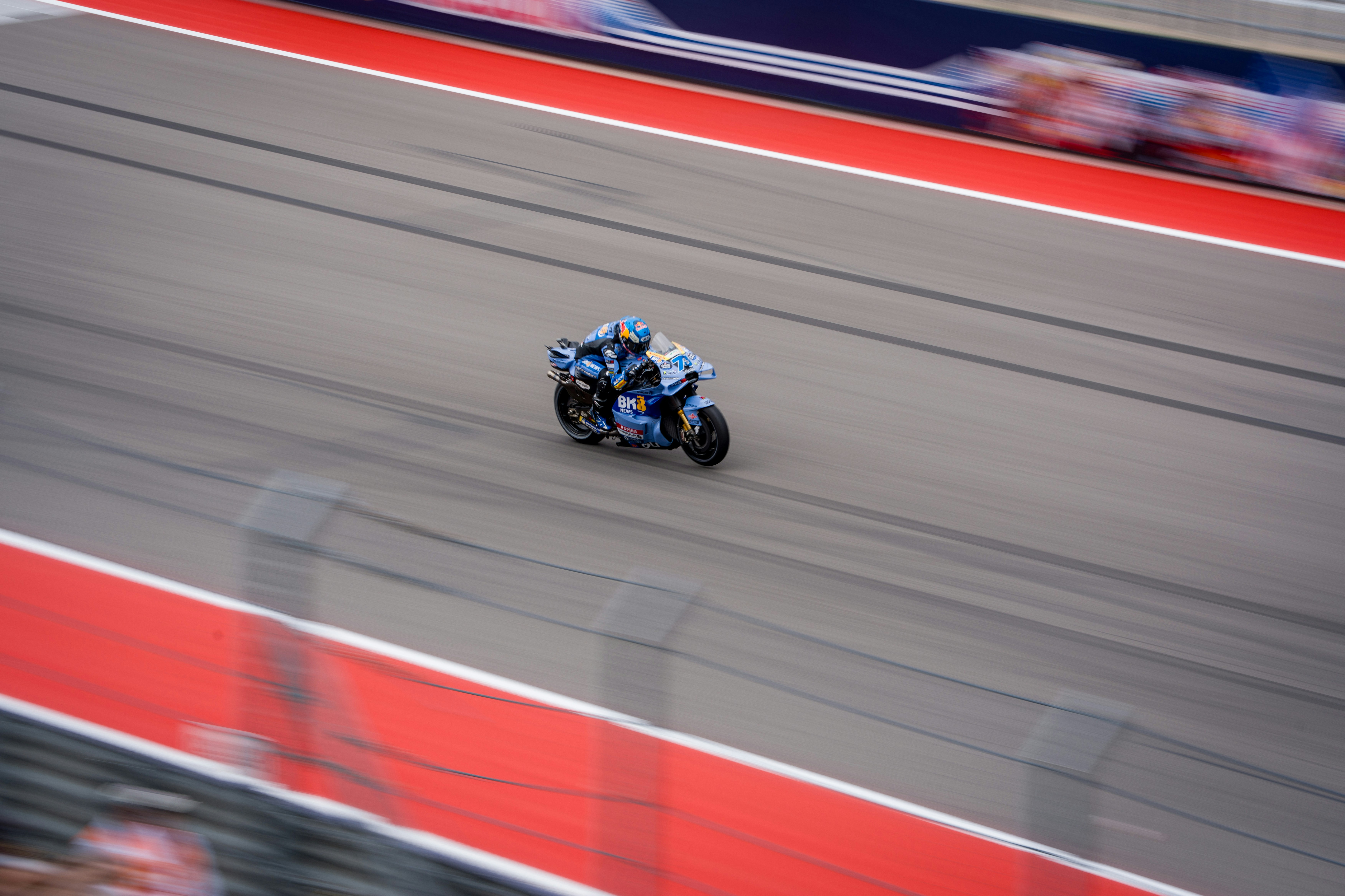 Rider in Focus: Lone Moto Surging Through a Painted Gorge