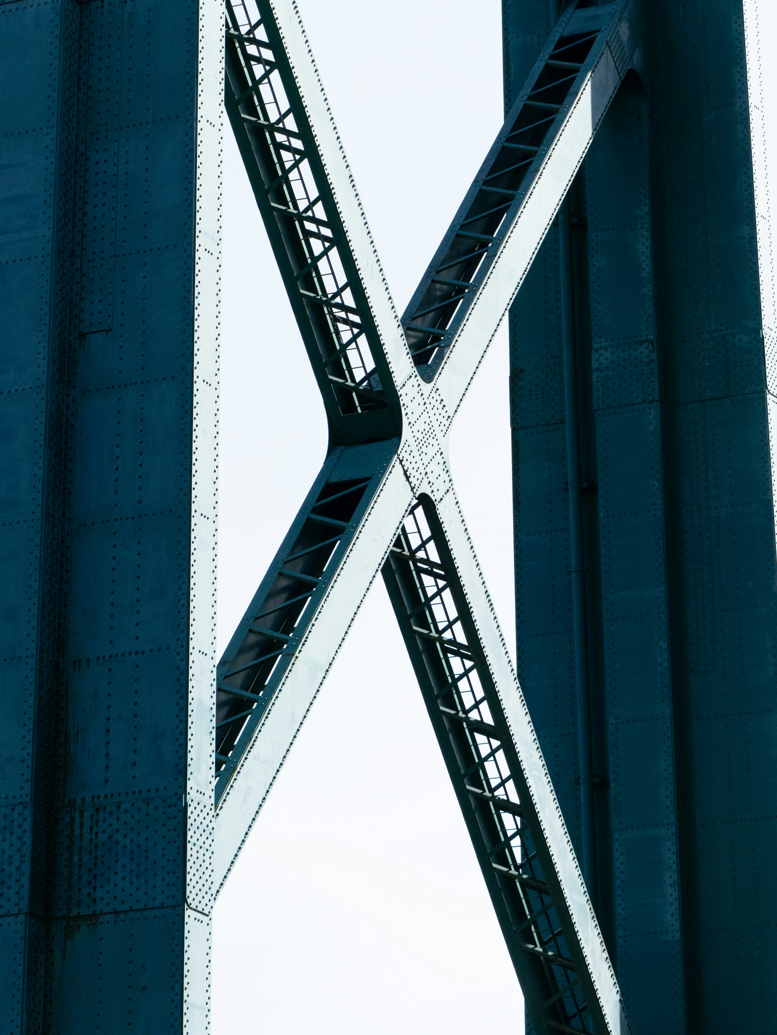 Crisscross of Blue Steel: A Bridge Structure Framed in White