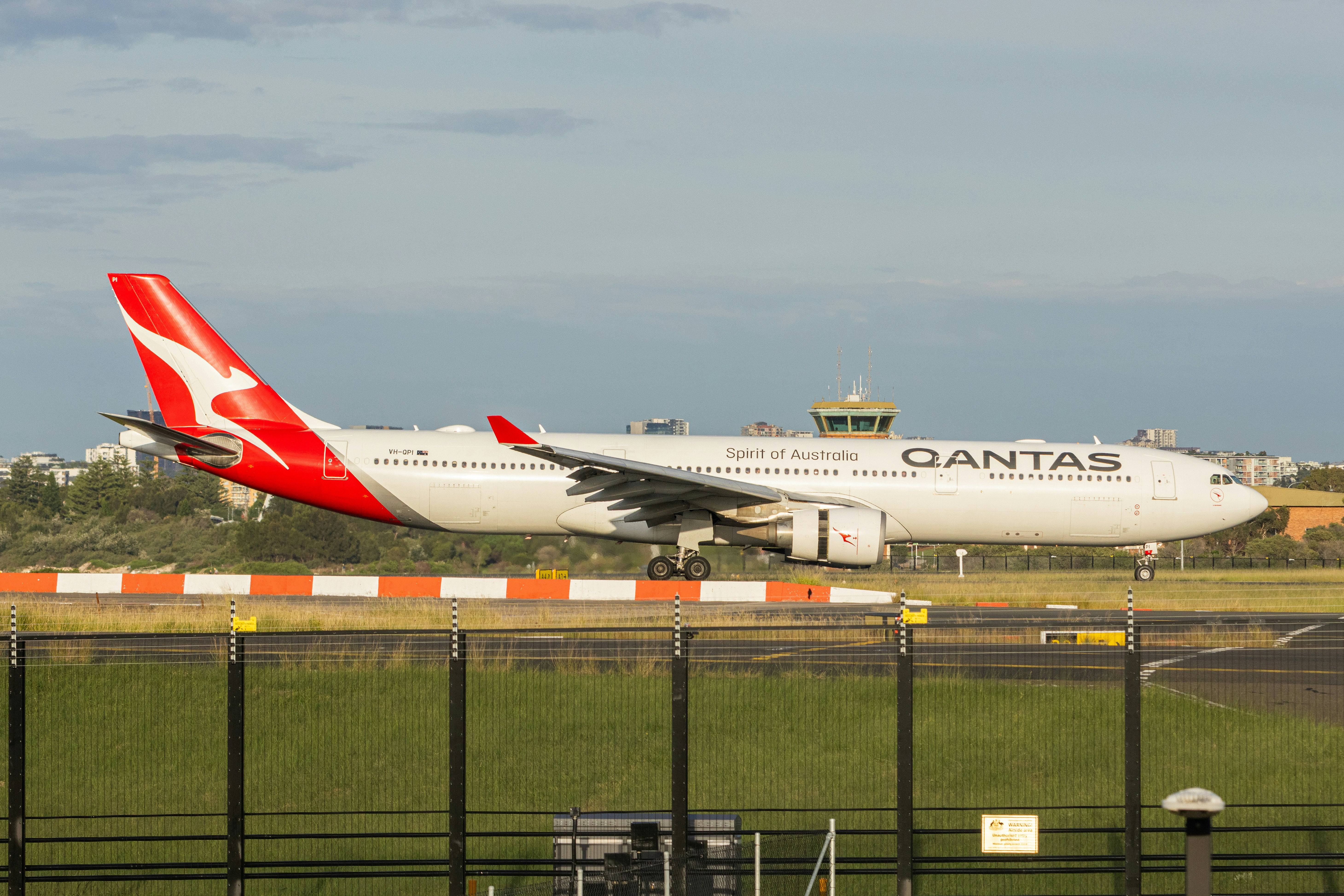 Qantas Dreamliner on the Tarmac: Pride of the Red Tail