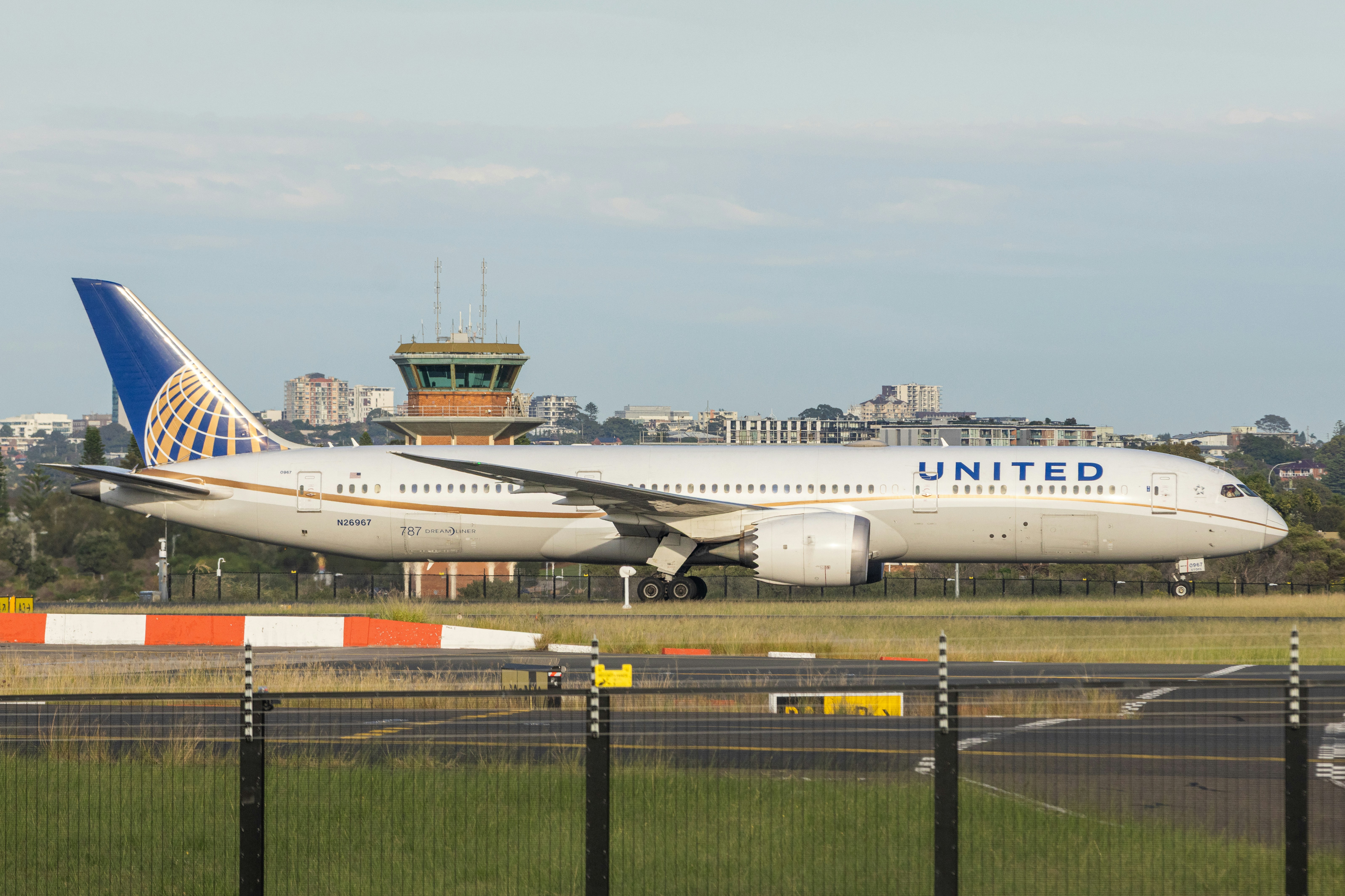 United in Silence: A Side Profile of a Jet on the Tarmac