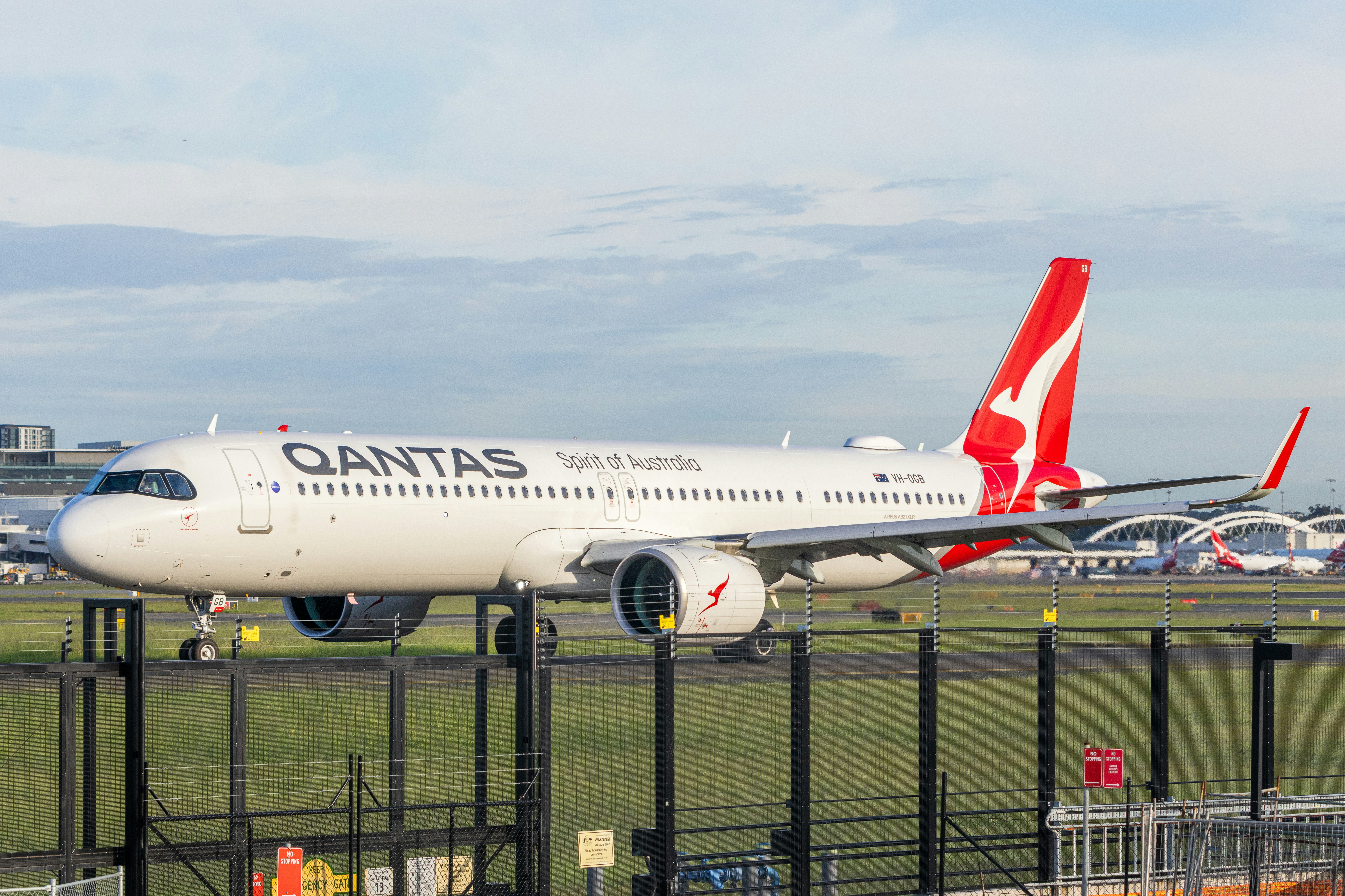 Qantas A320 Family on Tarmac: Front-Quarter Calm at a Busy Gate