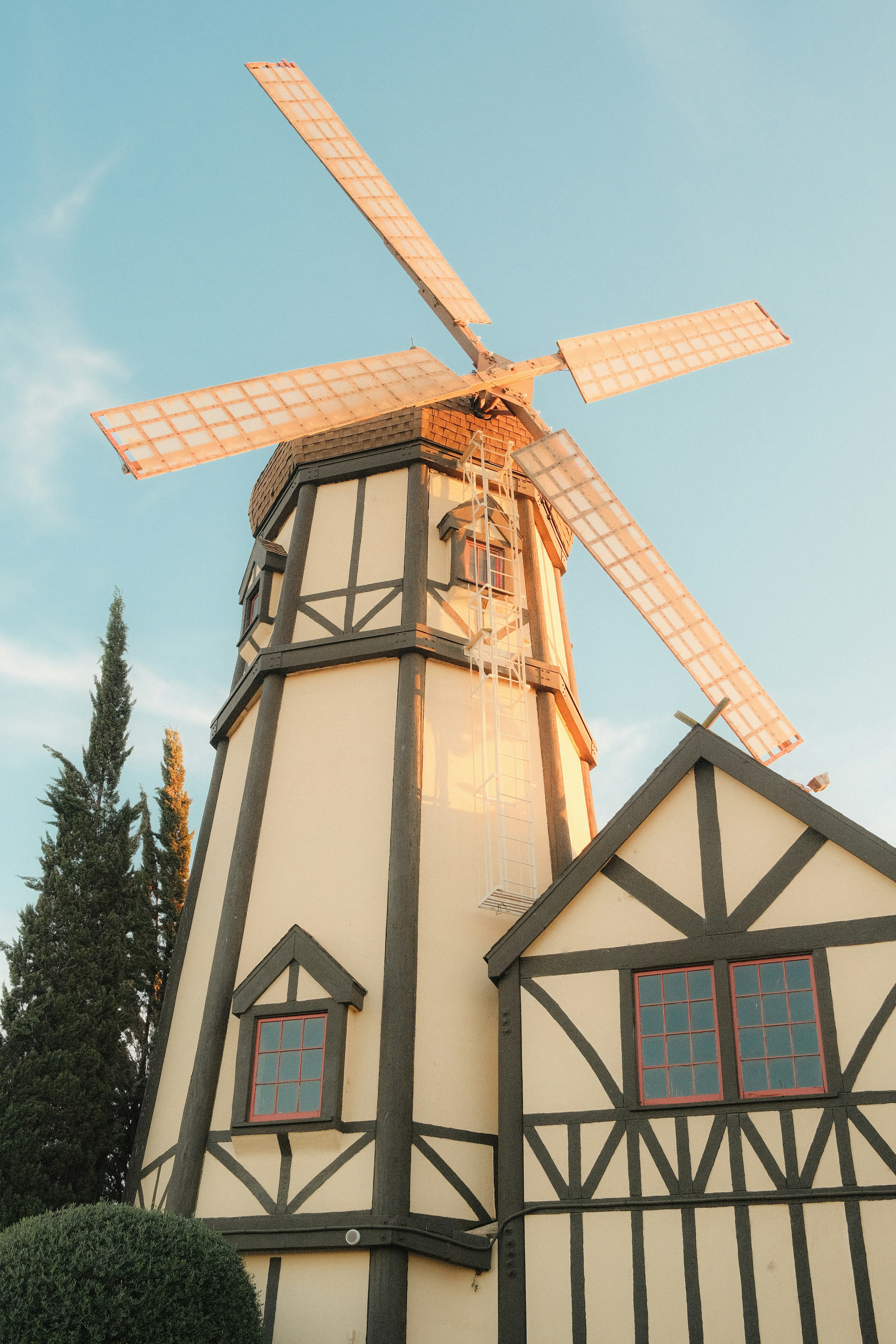 Timber Windmill on a Cream-Tinted Cottage