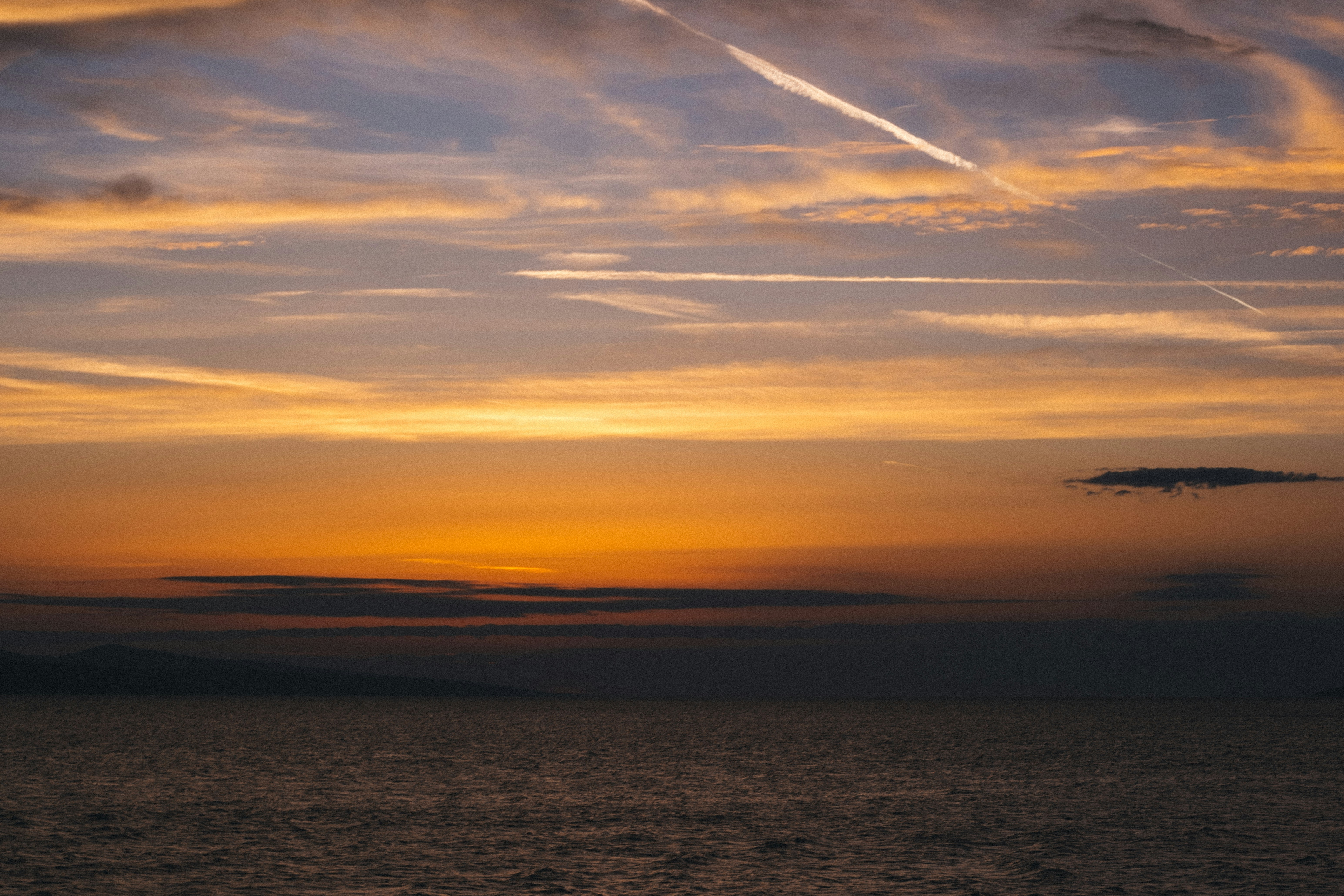 Horizon Blaze: Serenade of Dusk over Calm Waters
