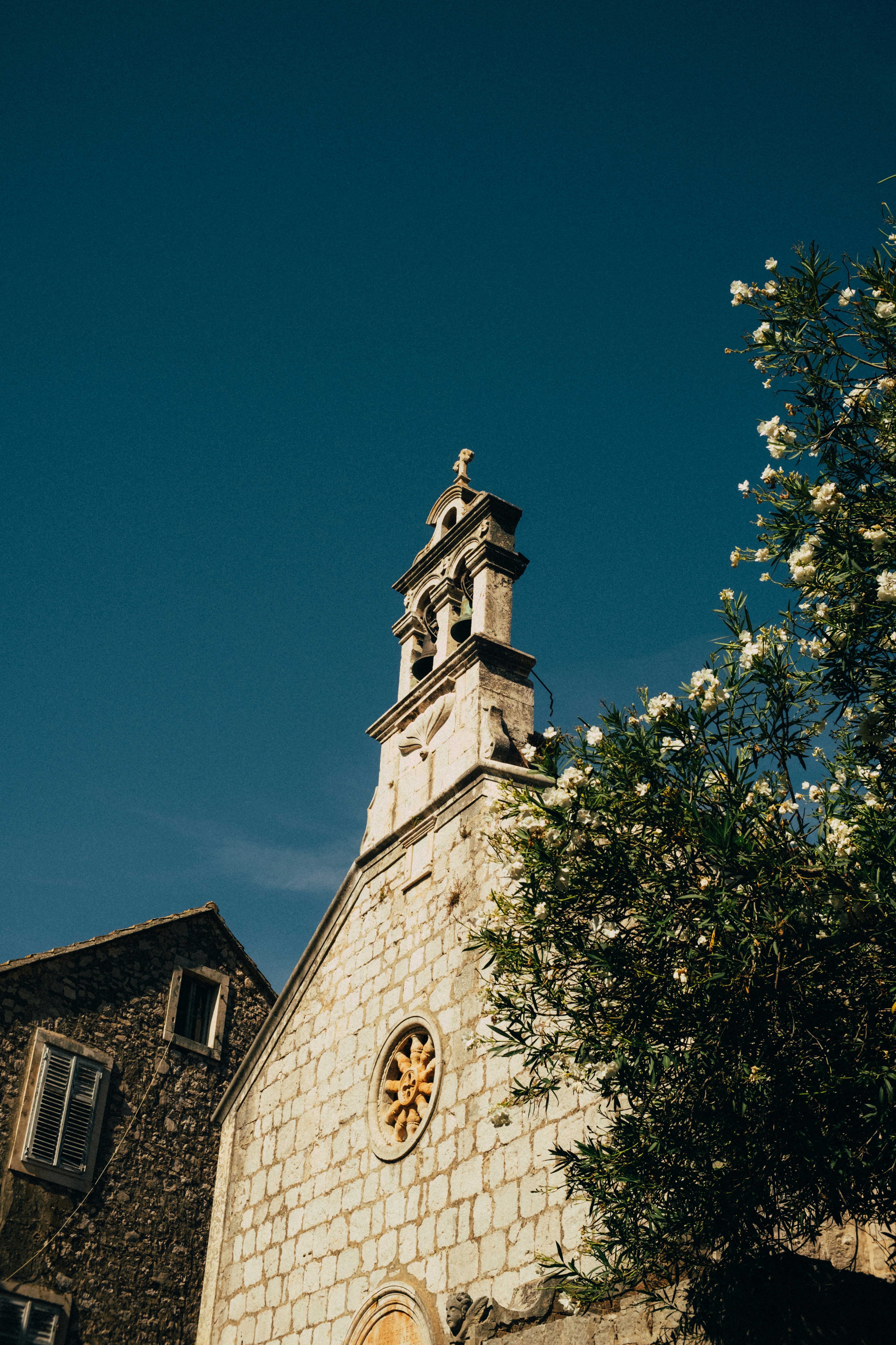 Stone Bell Tower Reaching Toward a Cerulean Sky
