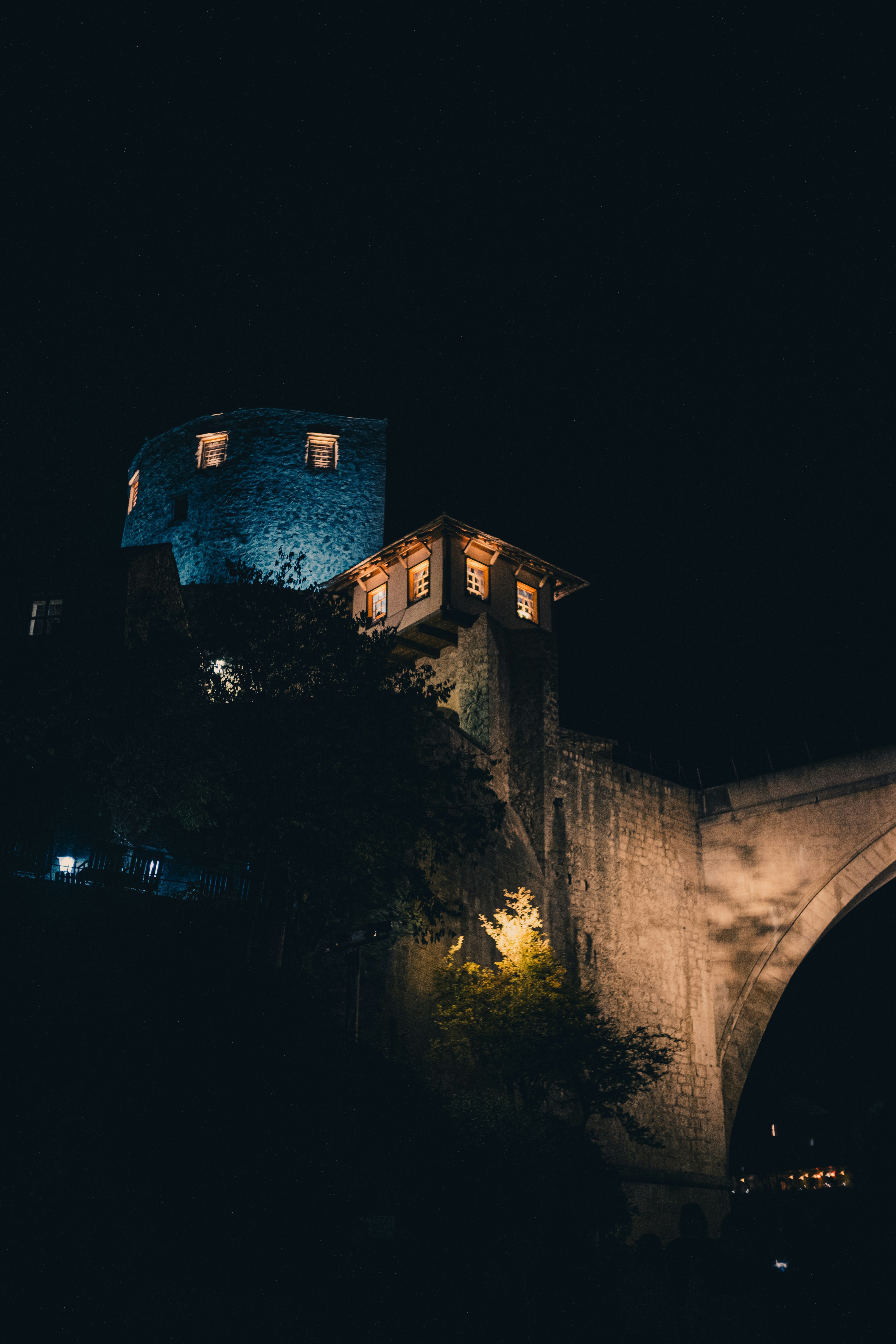Moonlit Keep: A Glowing Turret Above the Silent Bridge