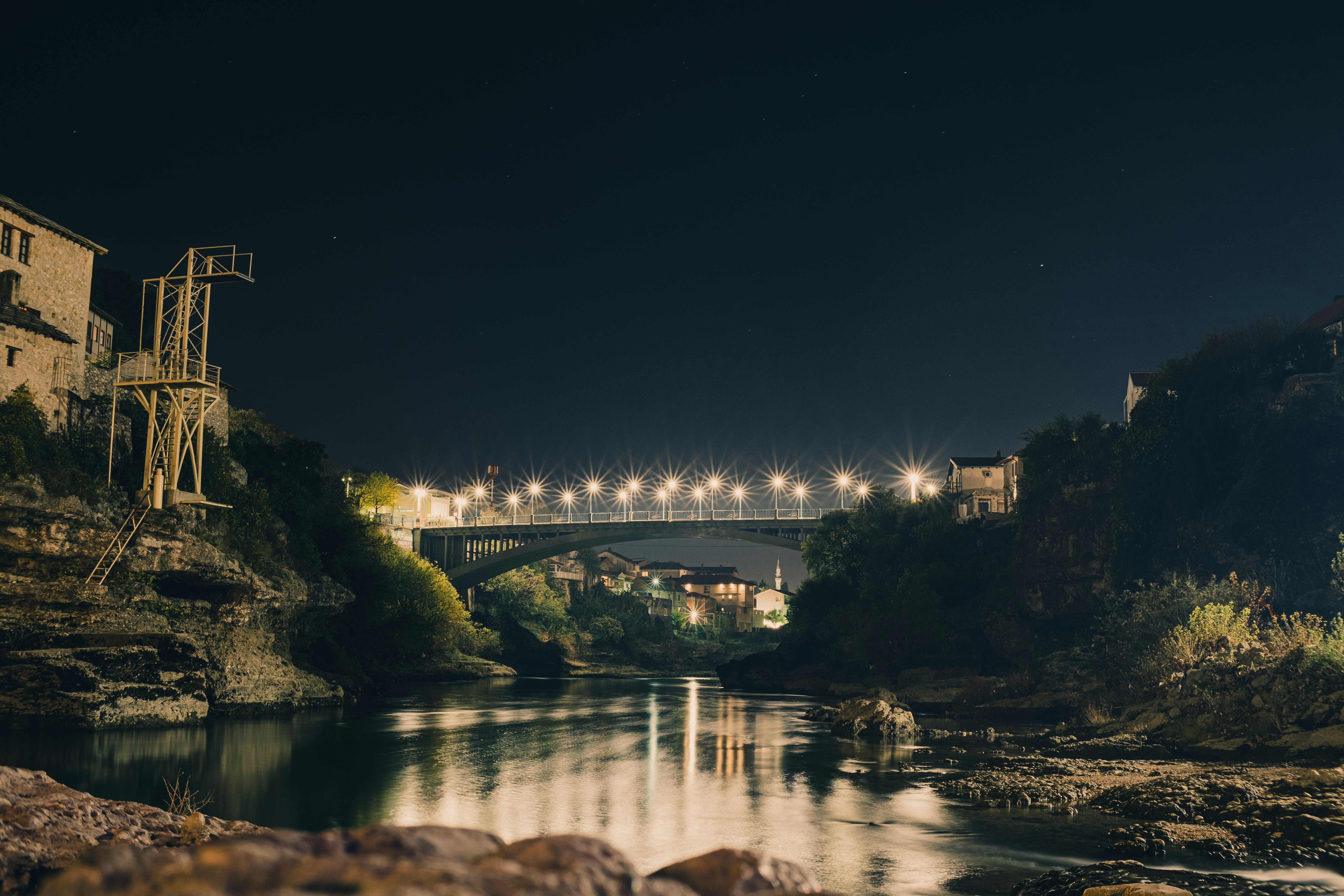 Moonlit River Overpass: Nighttime Bridge Lights Framing a Quiet Bend