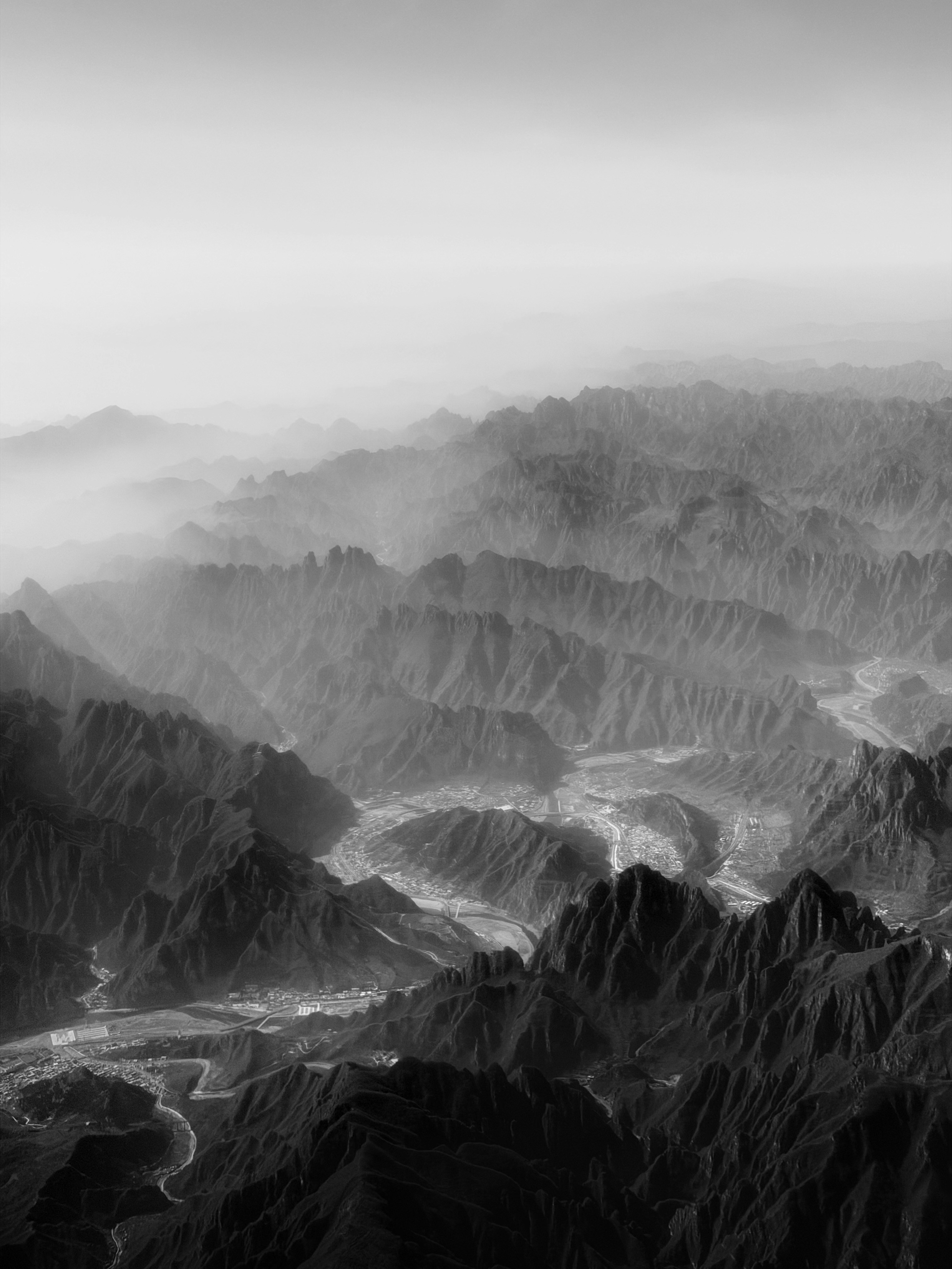 Morning Mist Over Ridged Valleys