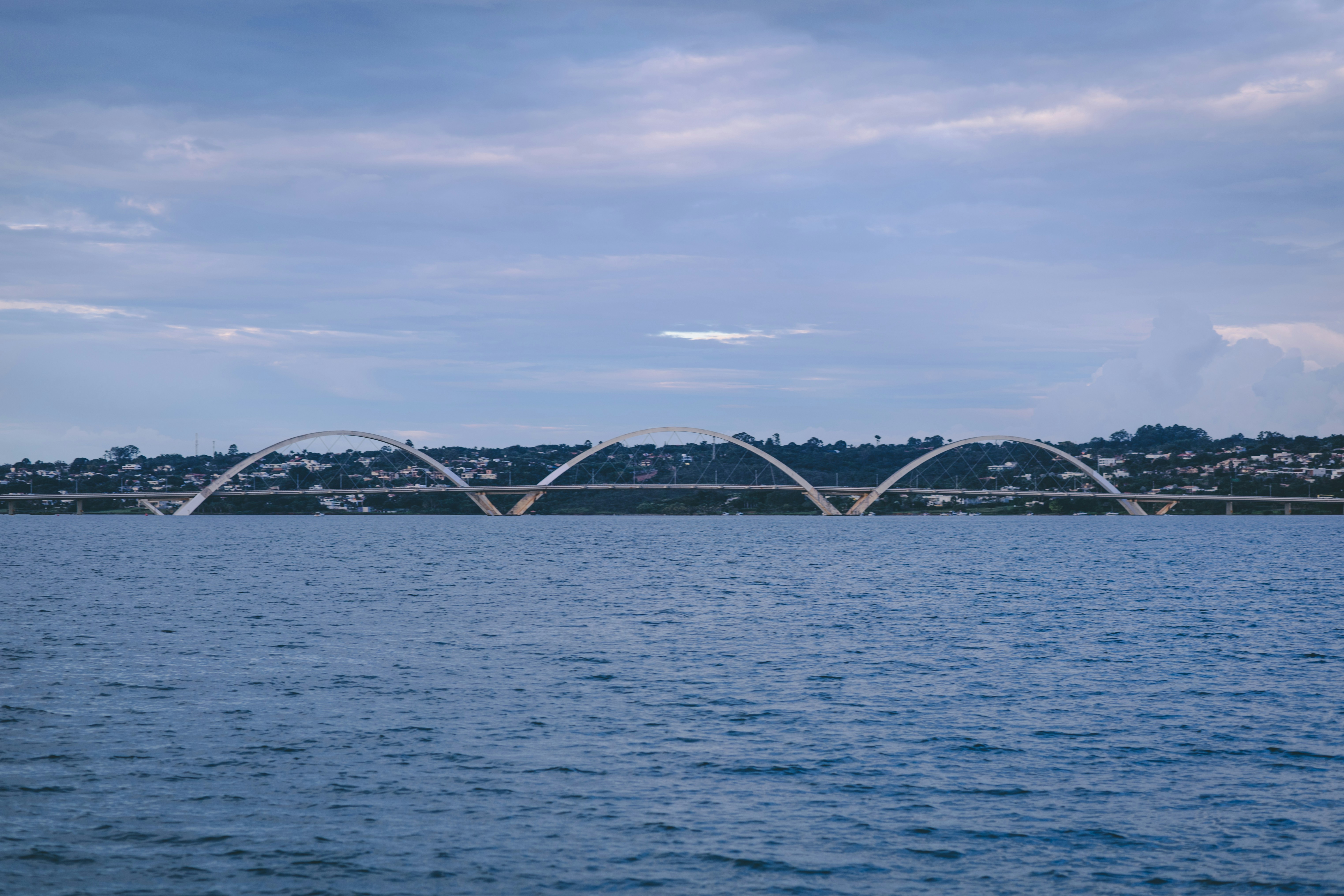 Arc of Waterfront Bridges: A Serene River Horizon