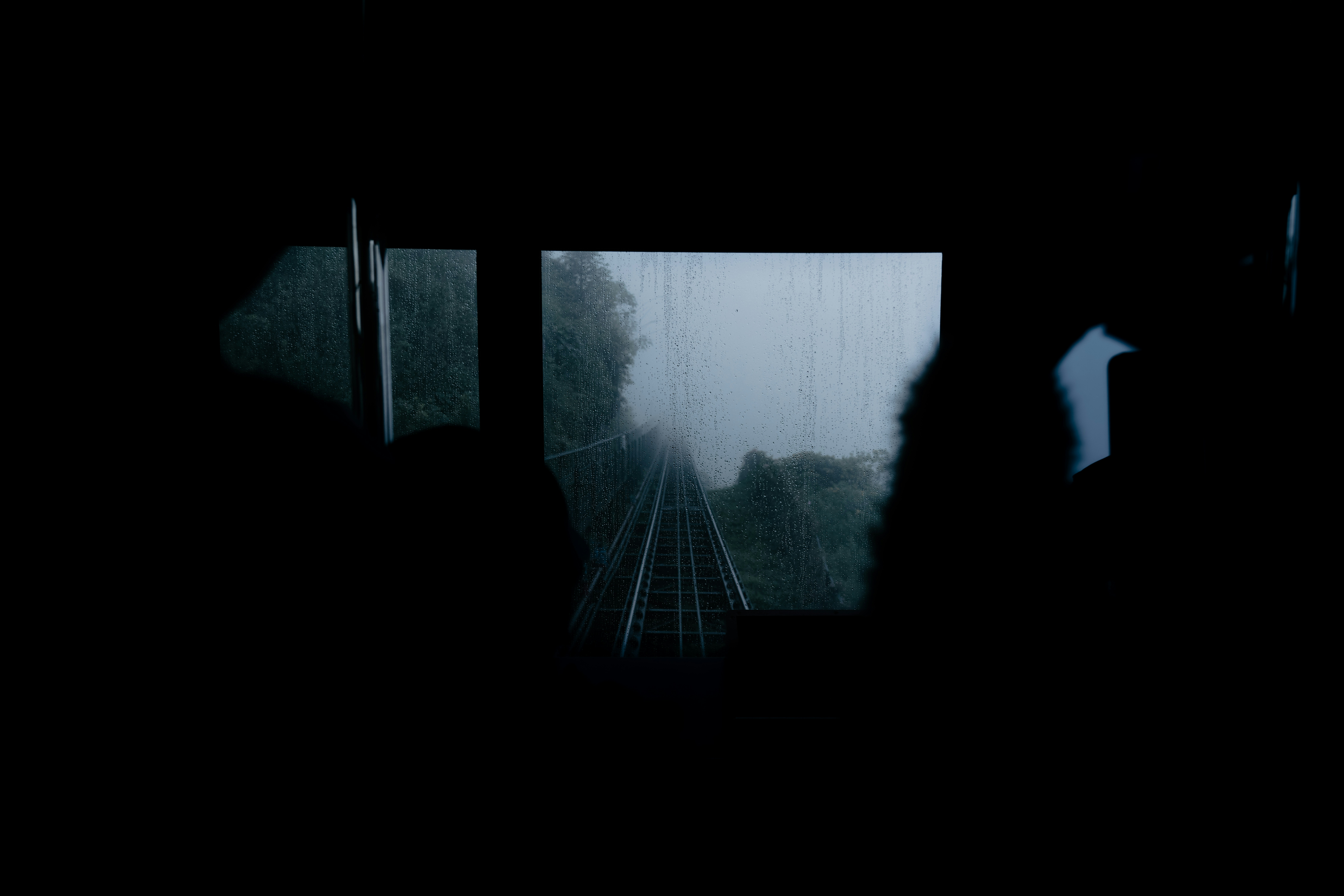 Through the Tunnel: Rails Vanish into Misty Darkness