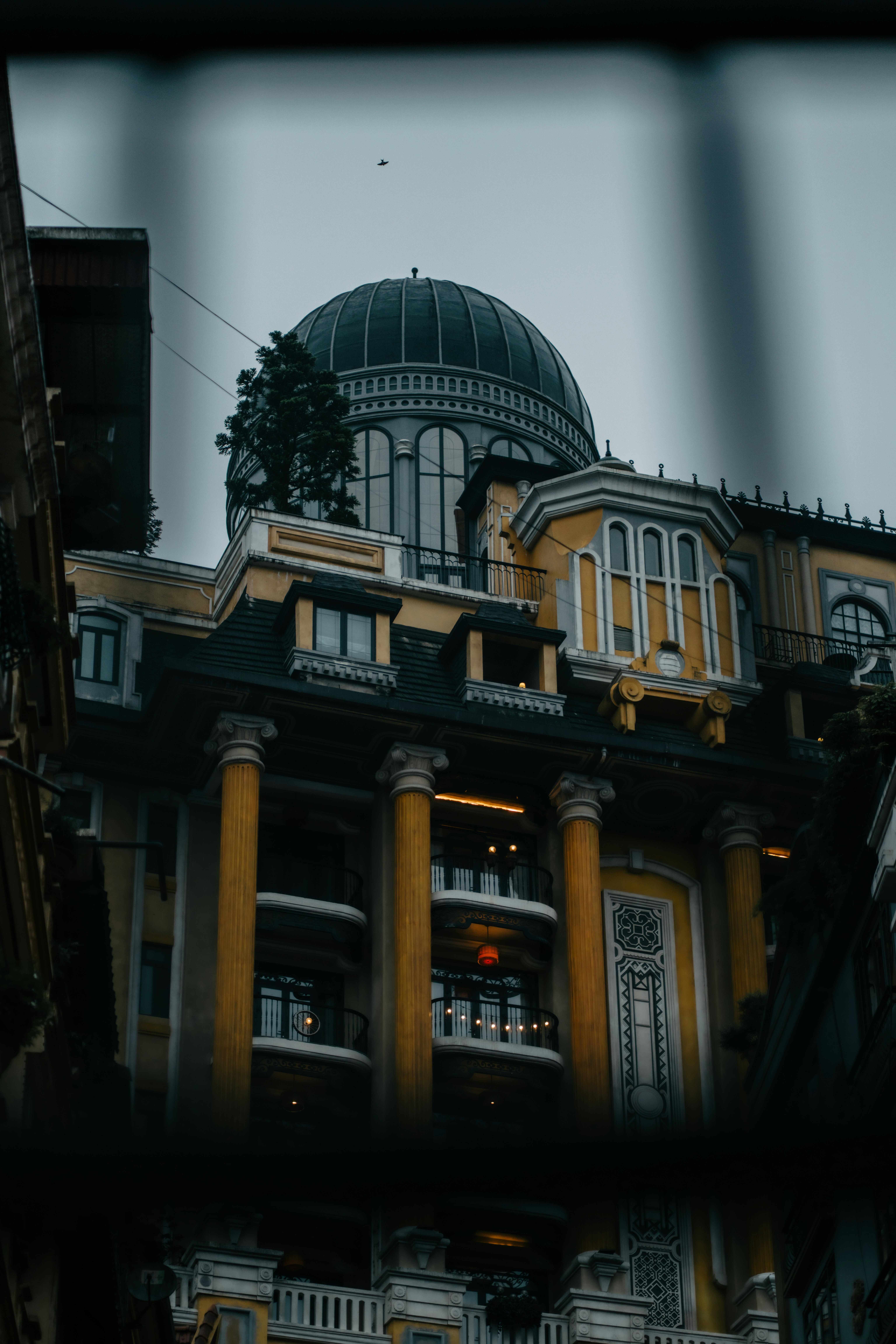A Dome and Columns: Ornate Architecture Rising Above a Narrow Street