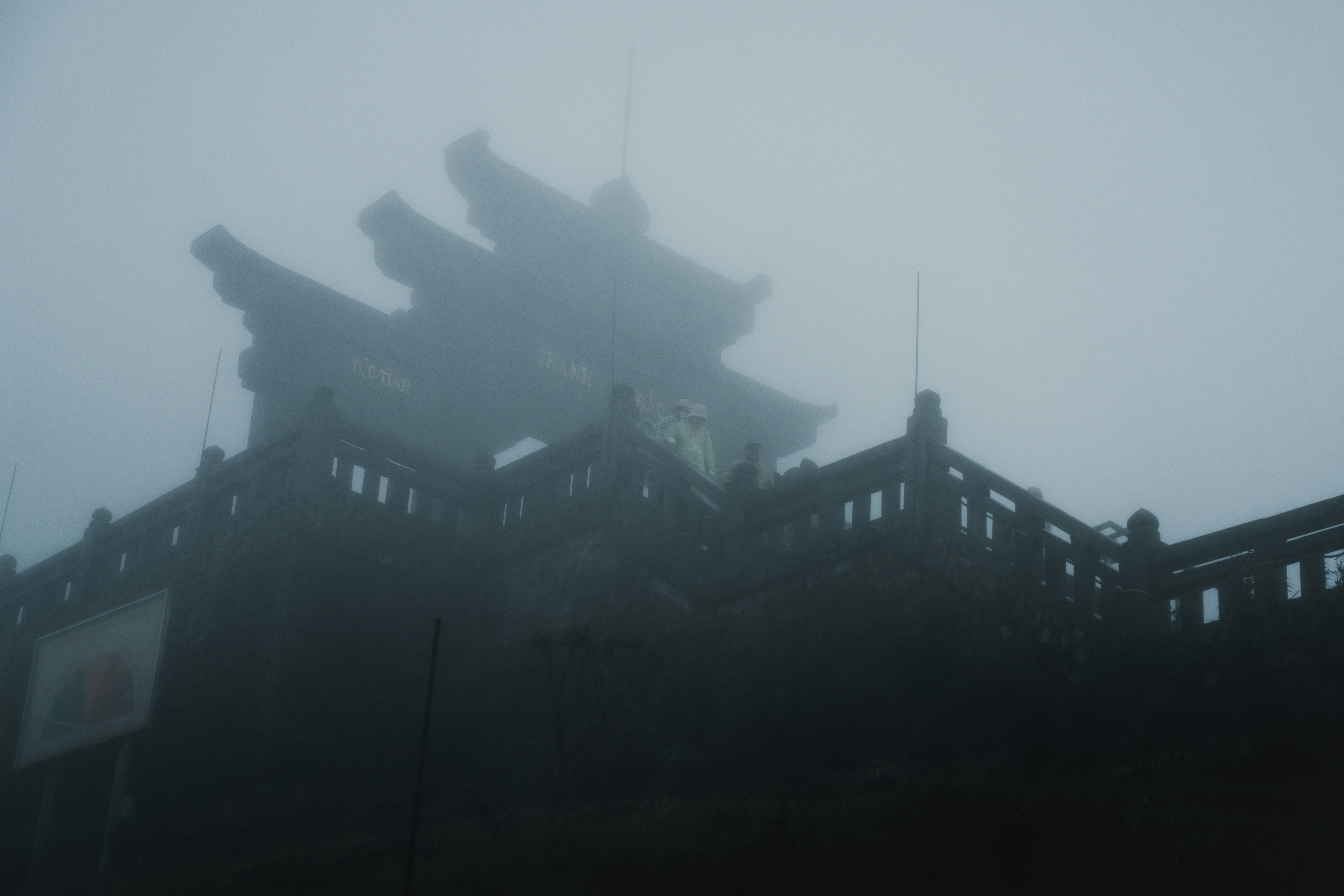 Hushed Summit: A Temple Emerges from the Mist