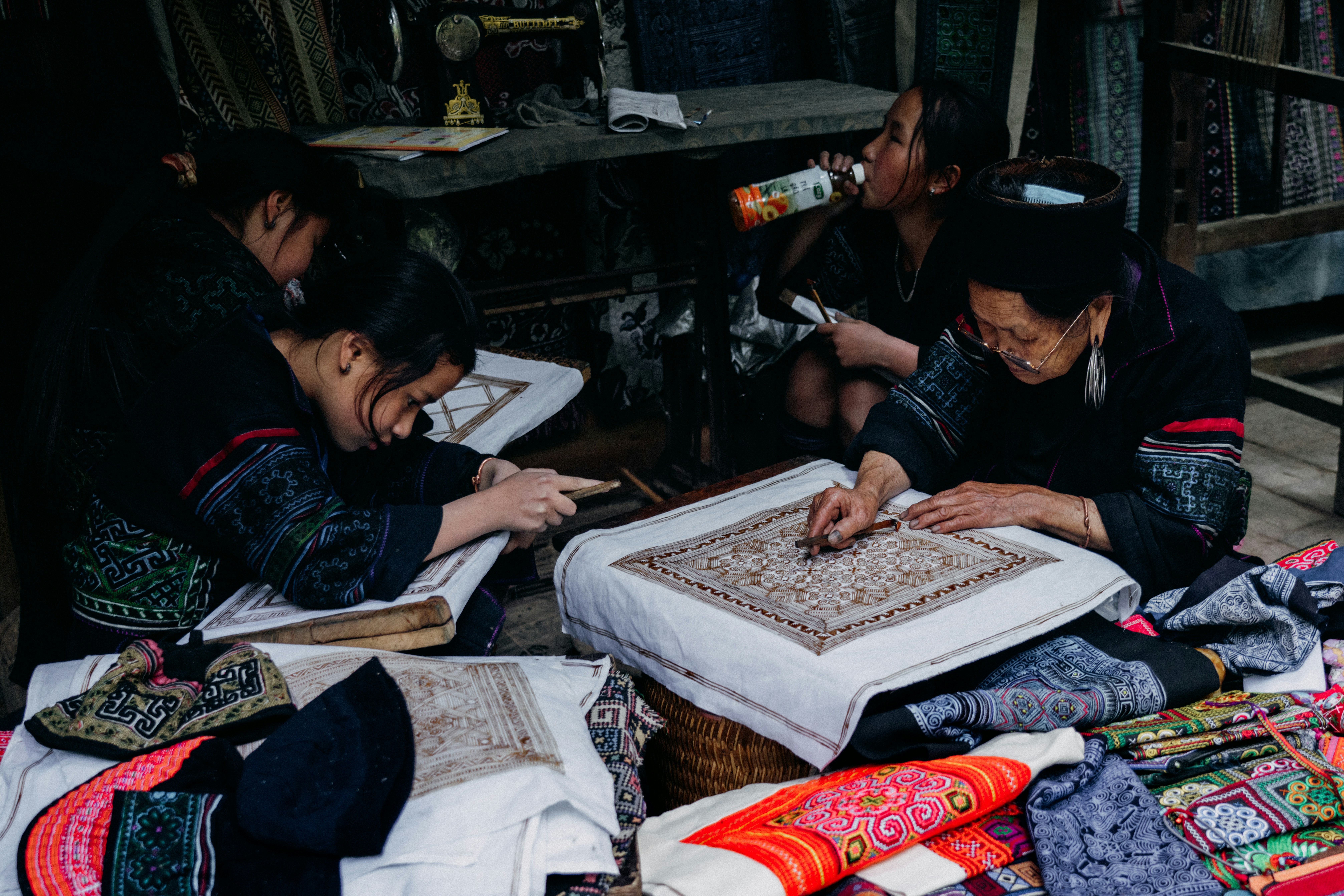 Hands at Work: Traditional Cloth Embroidery in a Bustling Studio