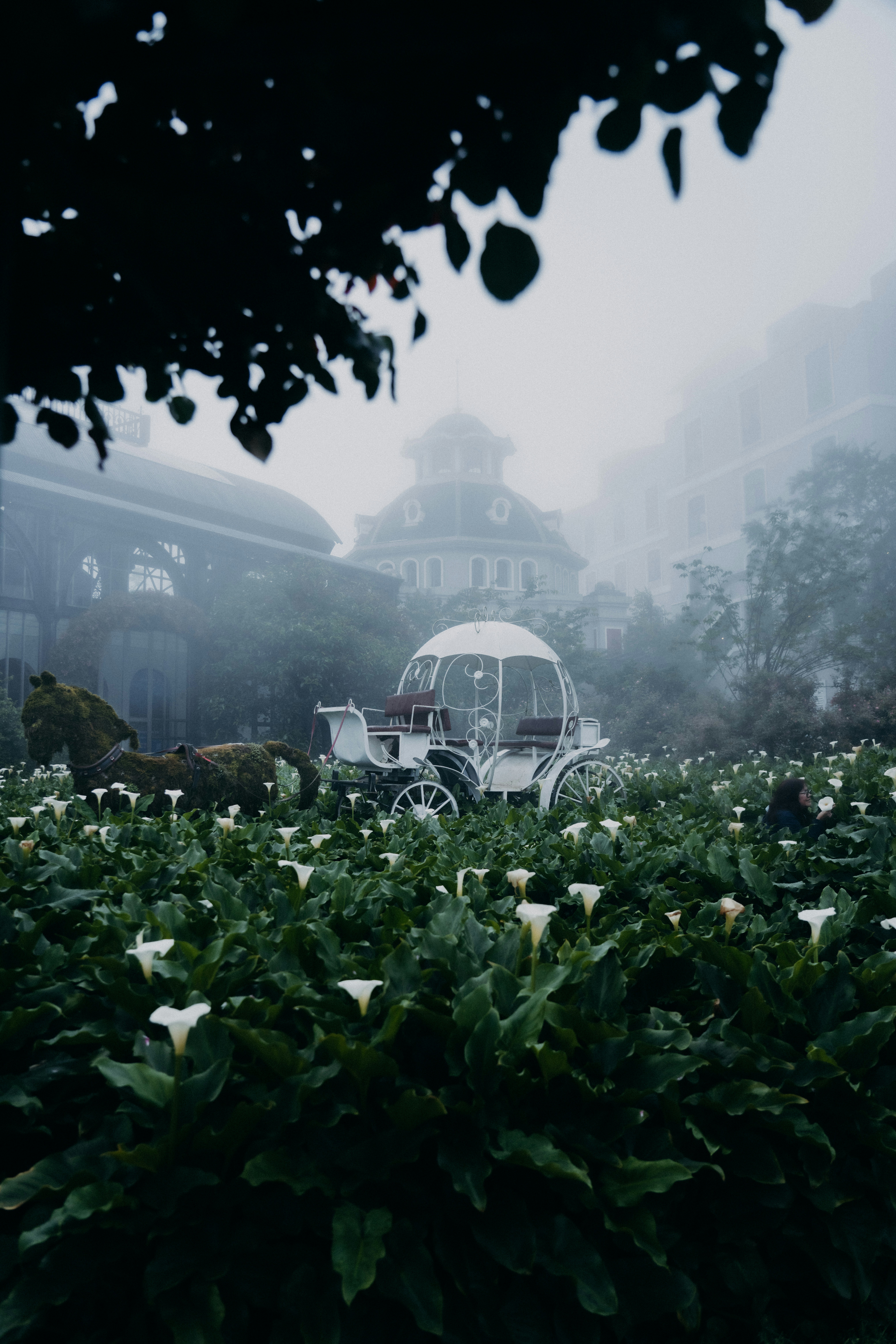 Moonlit Carriage in a Misty Floral Courtyard