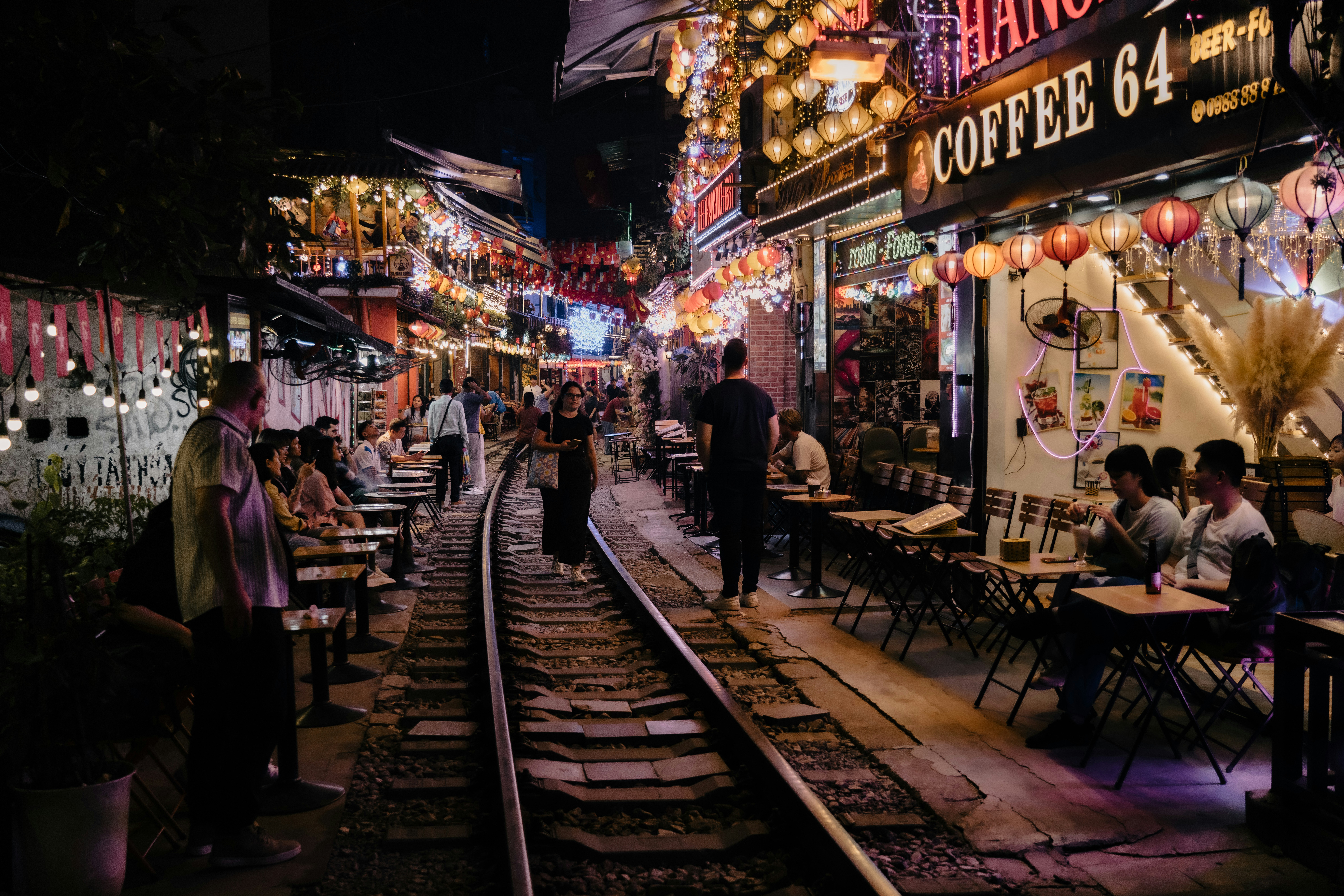 Railroad Lane Beneath Neon Night: A Dimly Lit Alley of Bites and Beats