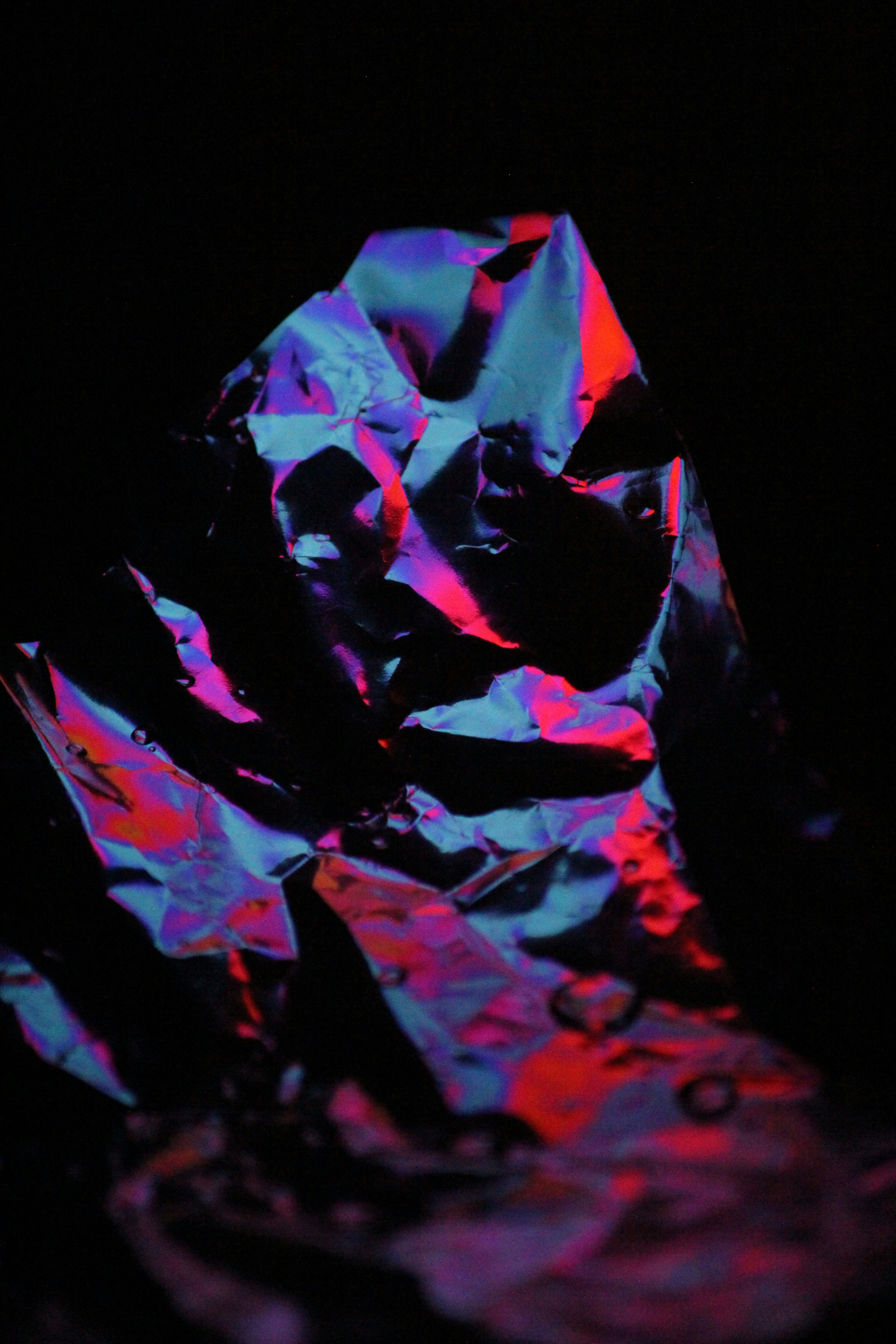 Prismatic Crystal: Neon Reflections in a Dark Vein