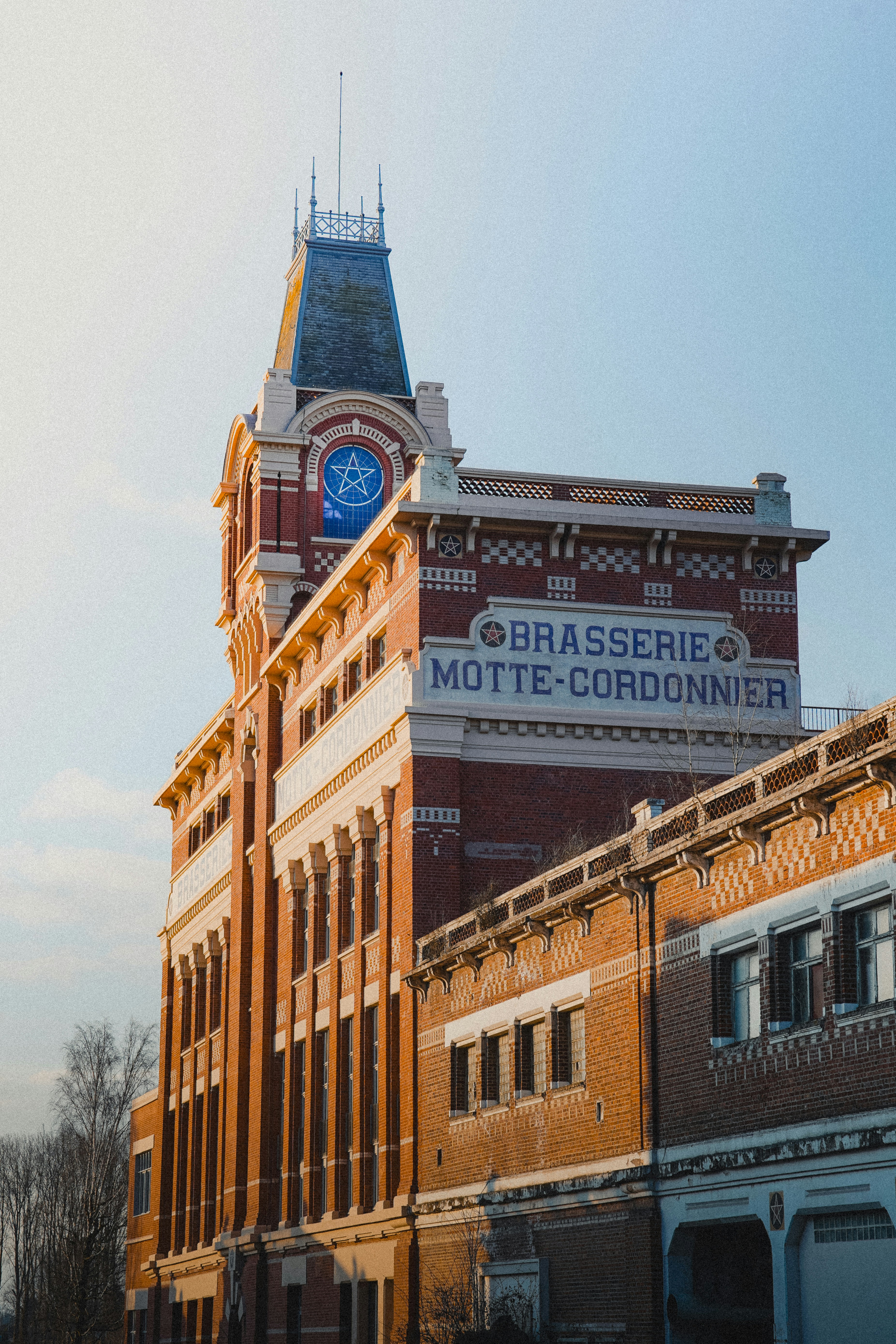 Clocktower Heritage: Brasserie Motte-Cordonner Guards the Brick Facade